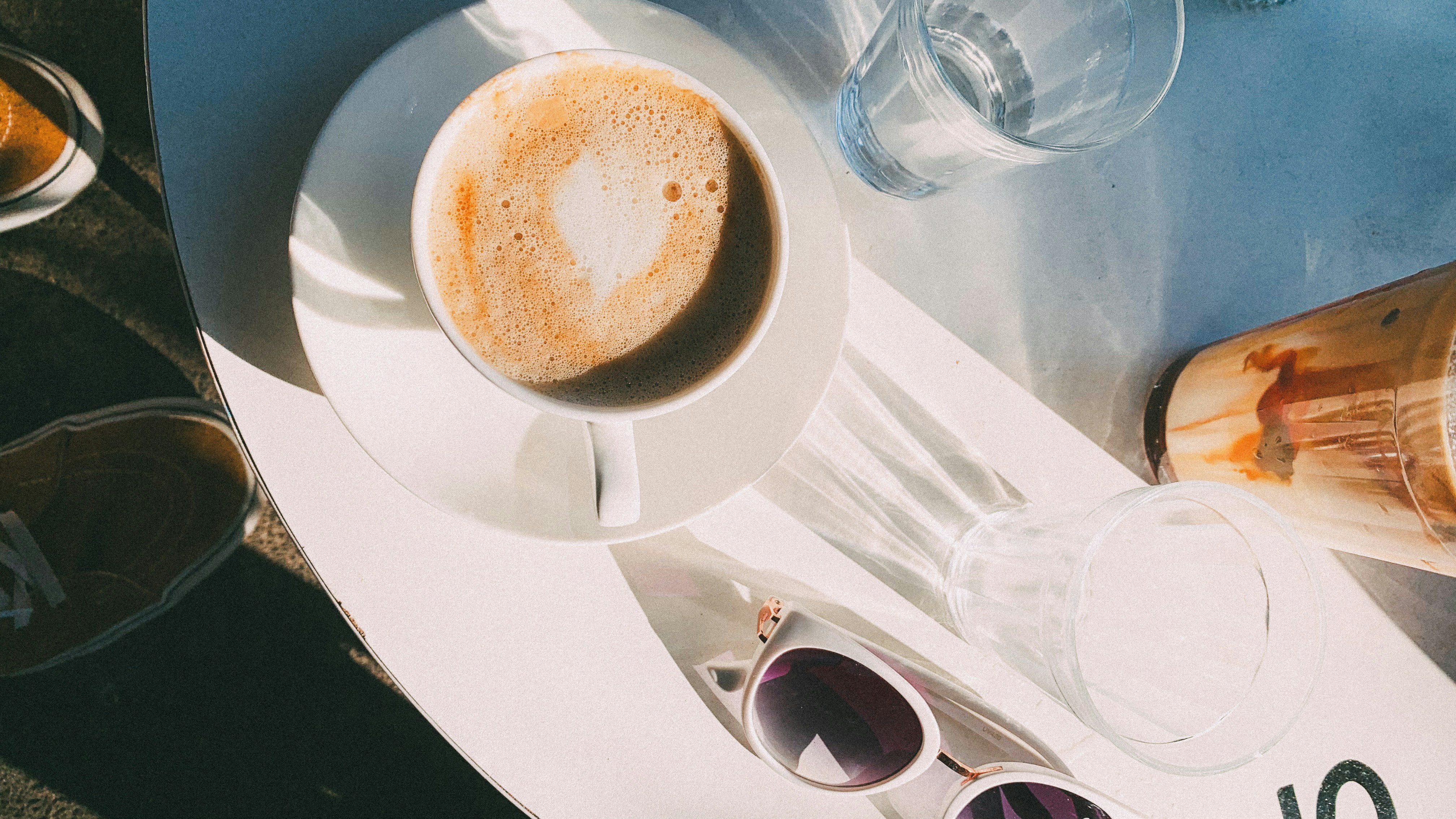 Cafe Corner: A Foamy Sunrise on Ceramic and Glass