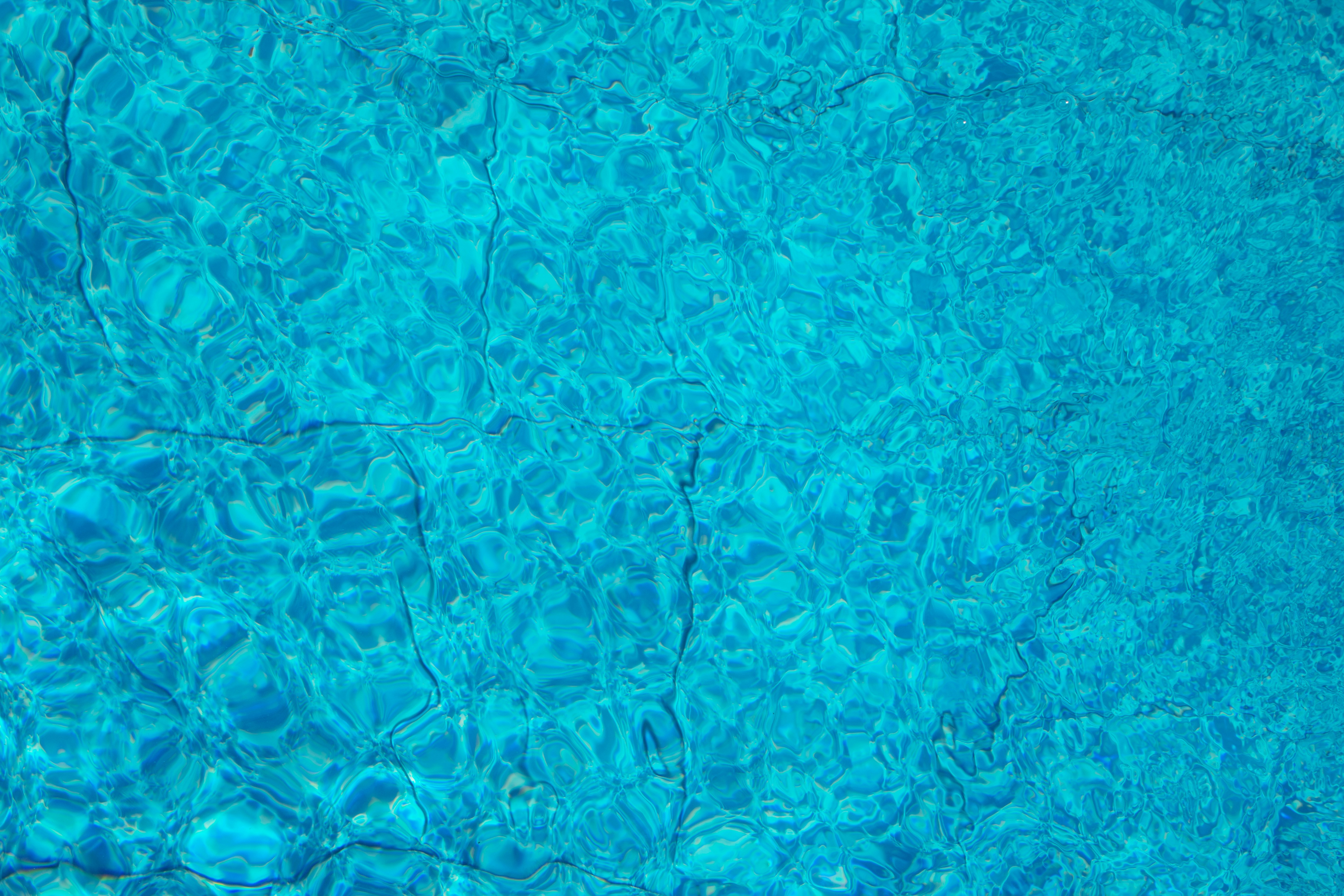 Sunlit Knots of Blue: Ripples in a Pool