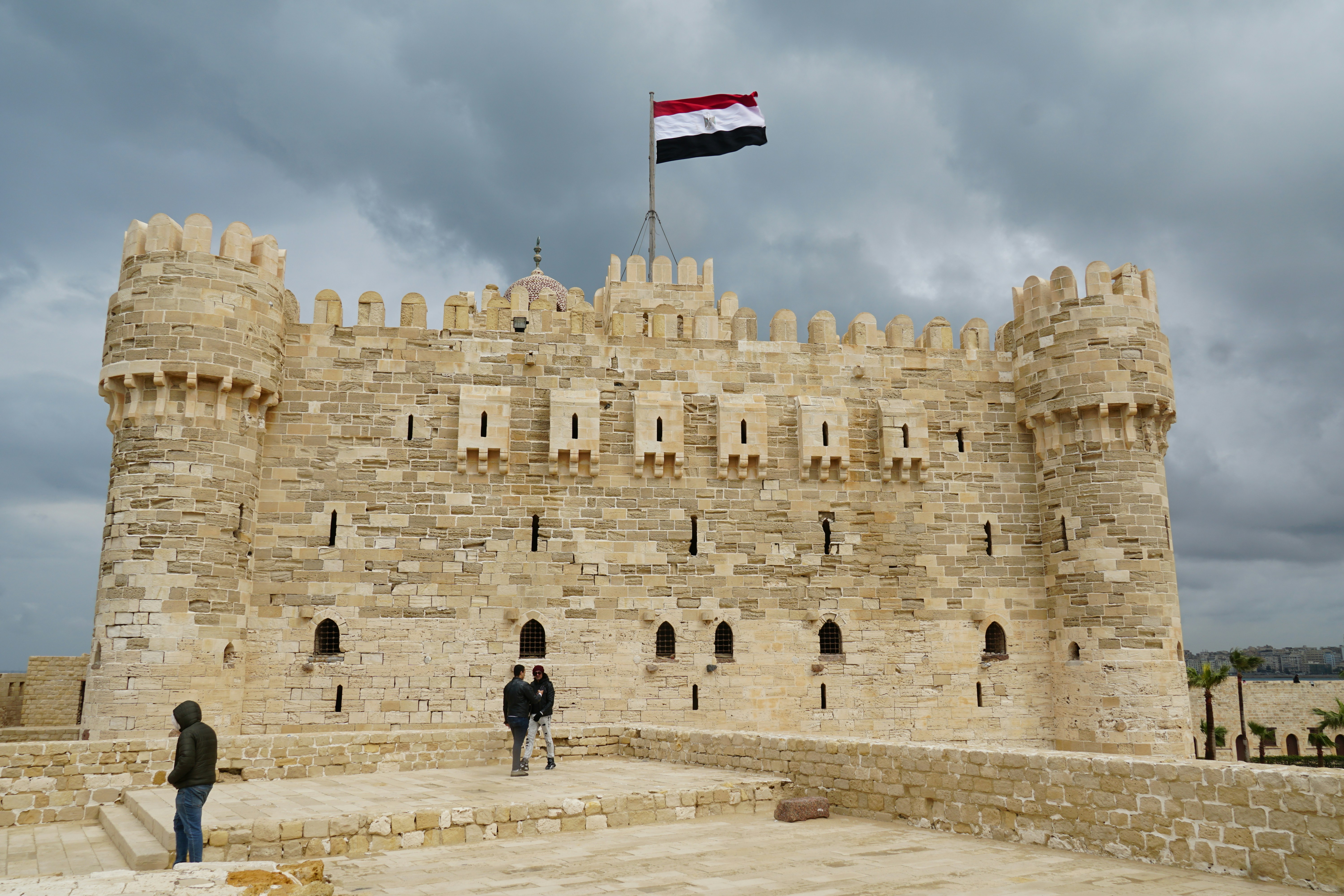 Stand at the Gate: A Limestone Fortress Under a Stormy Sky