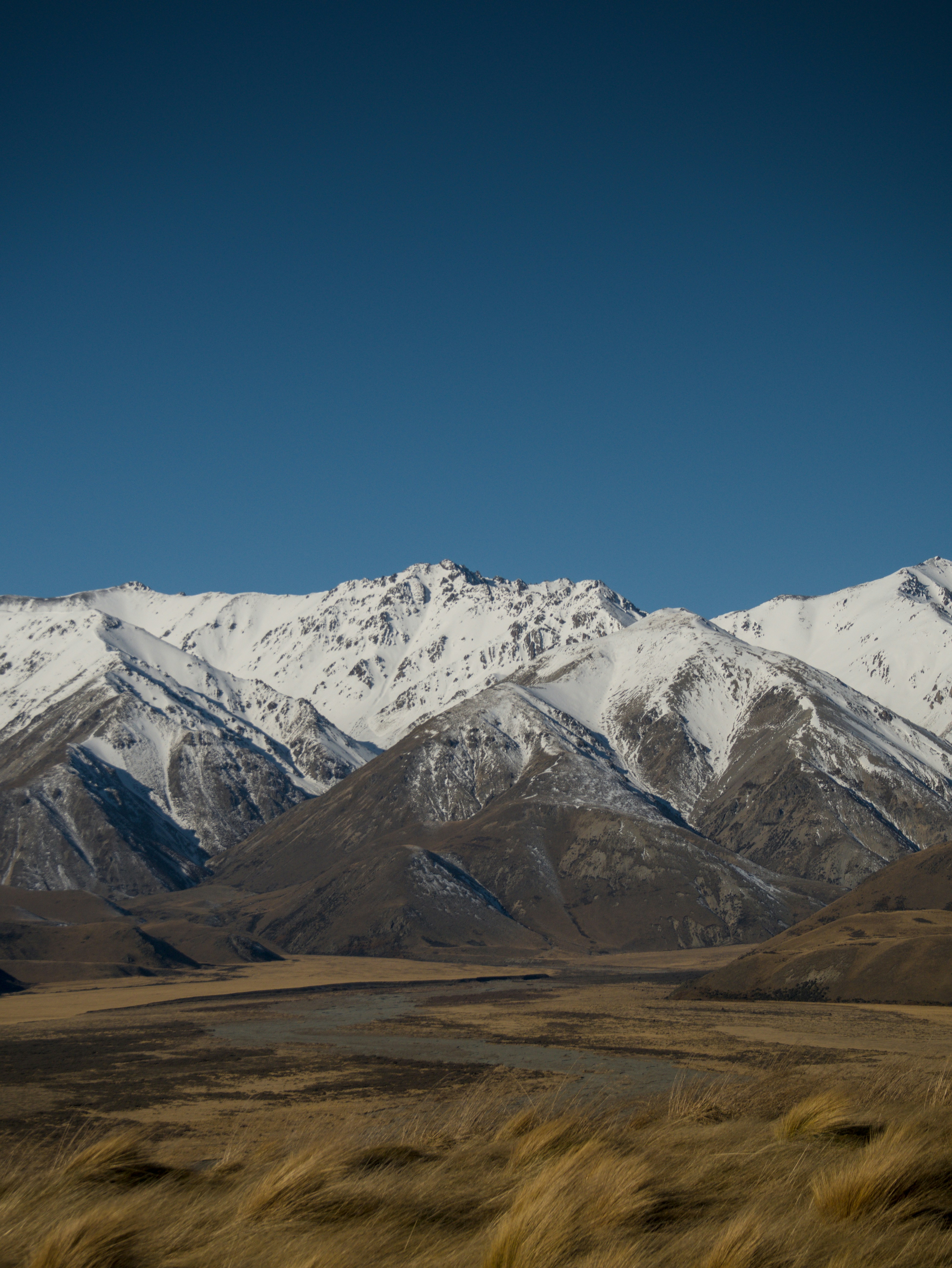 Snow-kissed Ridge Under a Cerulean Gaze