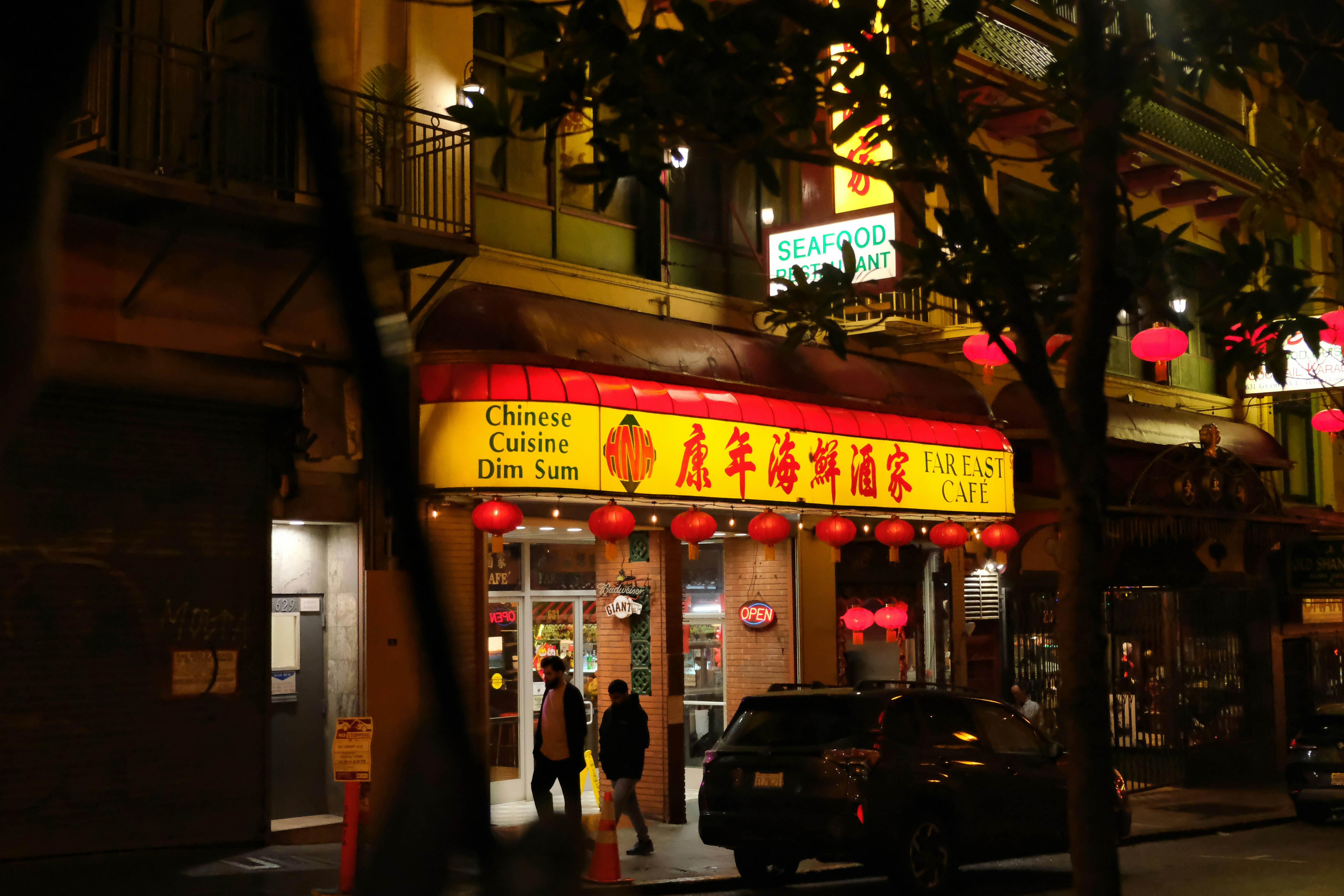 Neon Lanterns Over a Bustling Chinatown Eatery