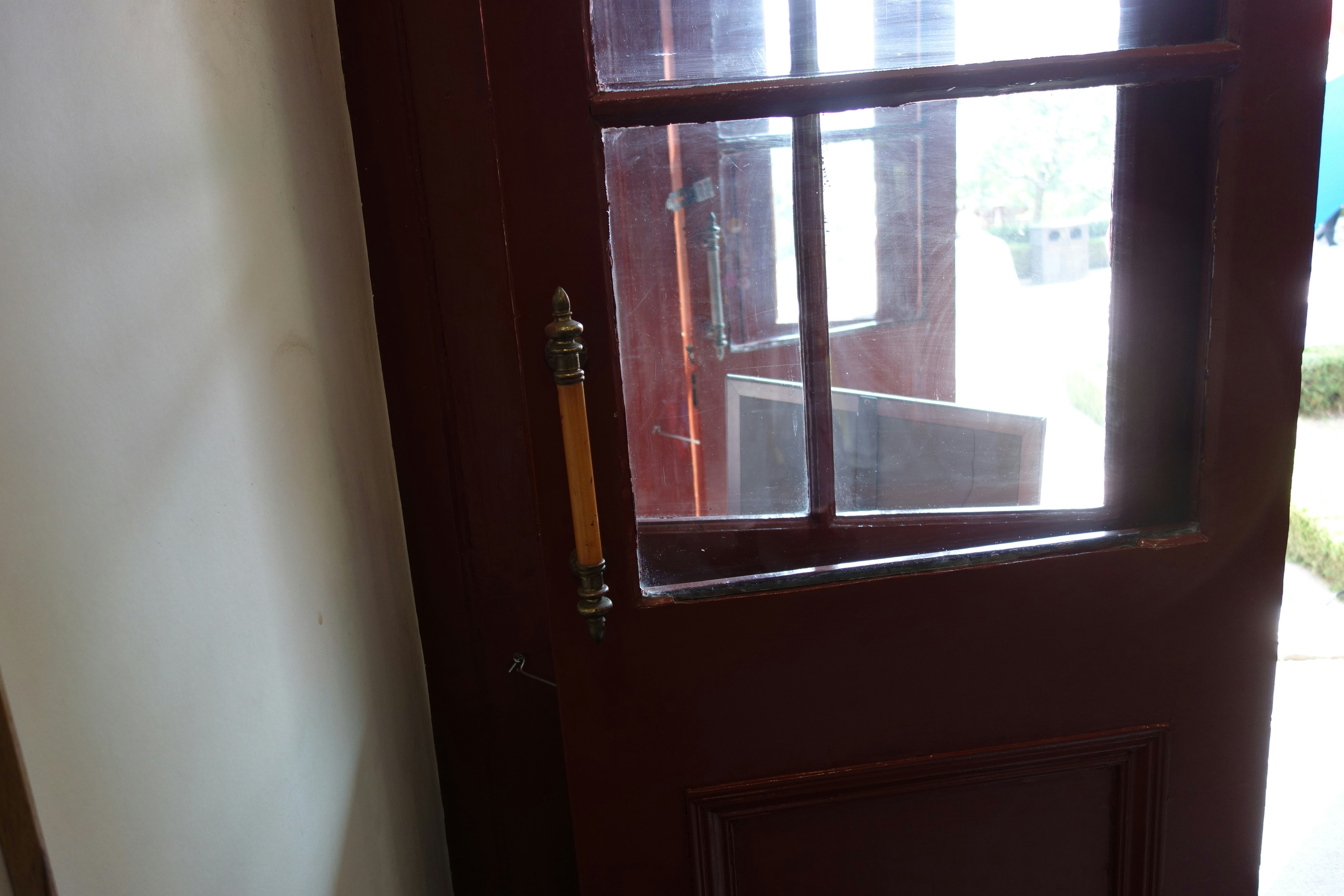 Weathered Doorway with Glasspaned Window Reflections