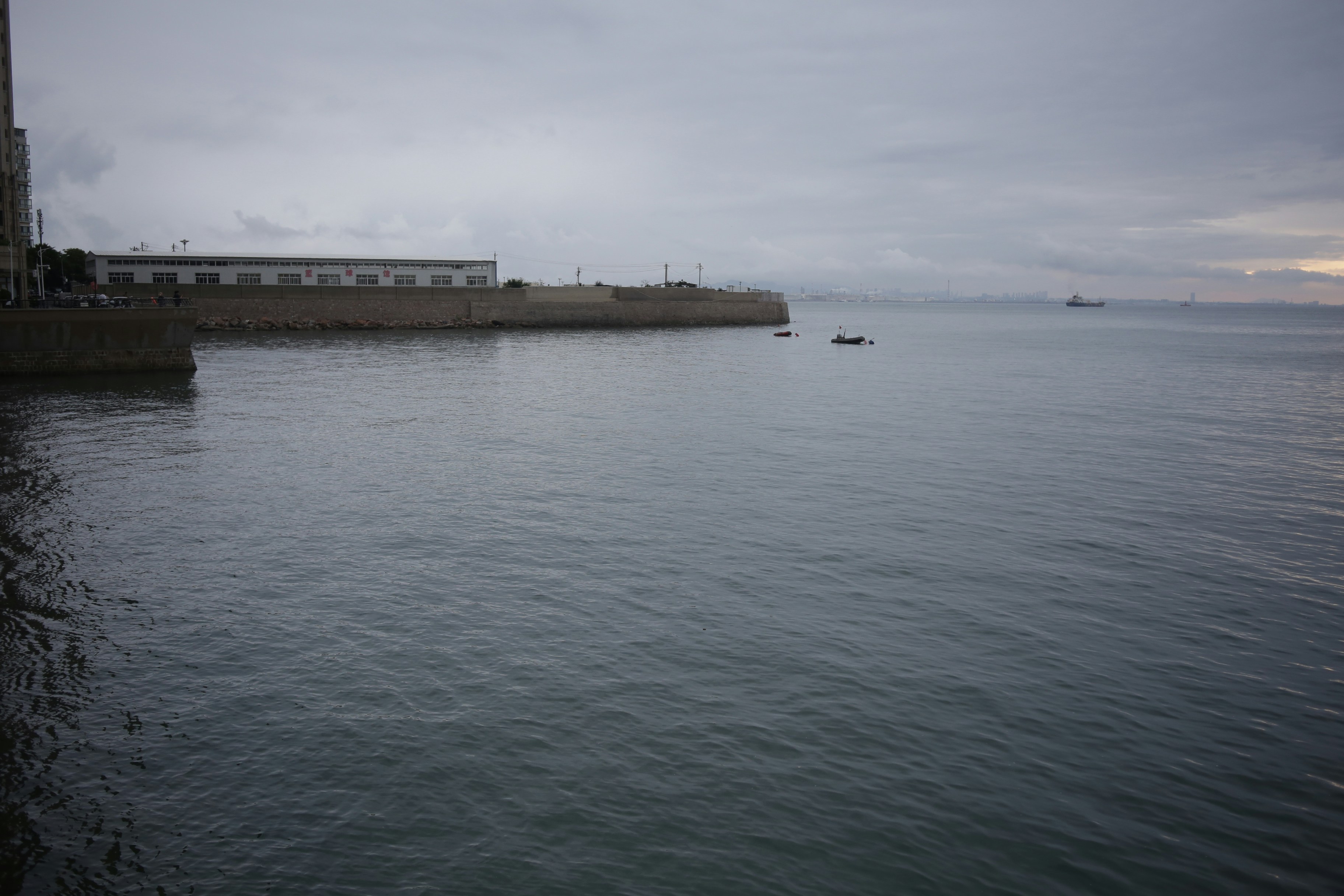 Quiet Basin at Dusk: Boats Dot the Calm Harbor