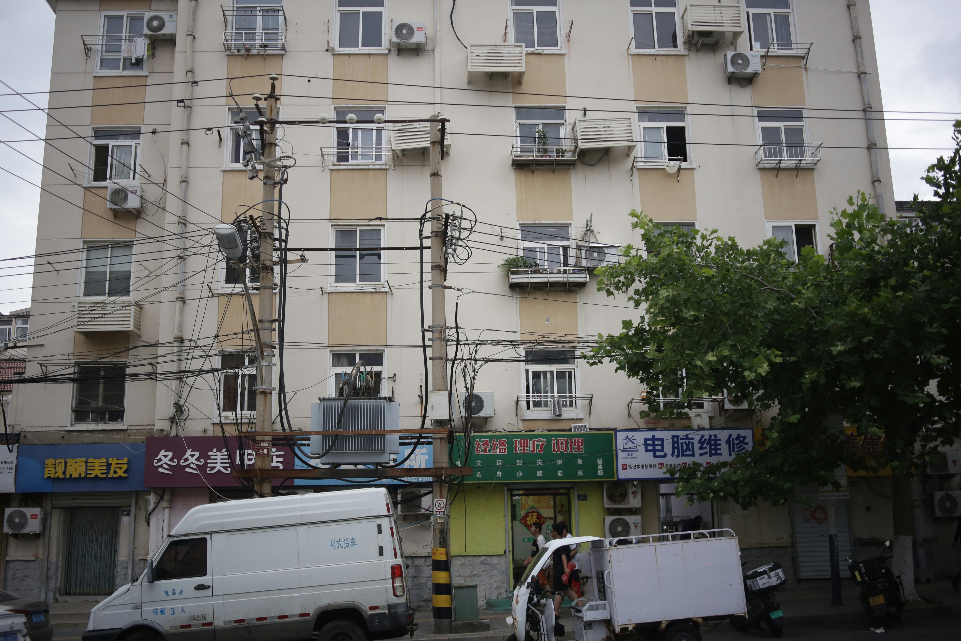 Urban Facade Echo: Street-Level Business and utility Cables