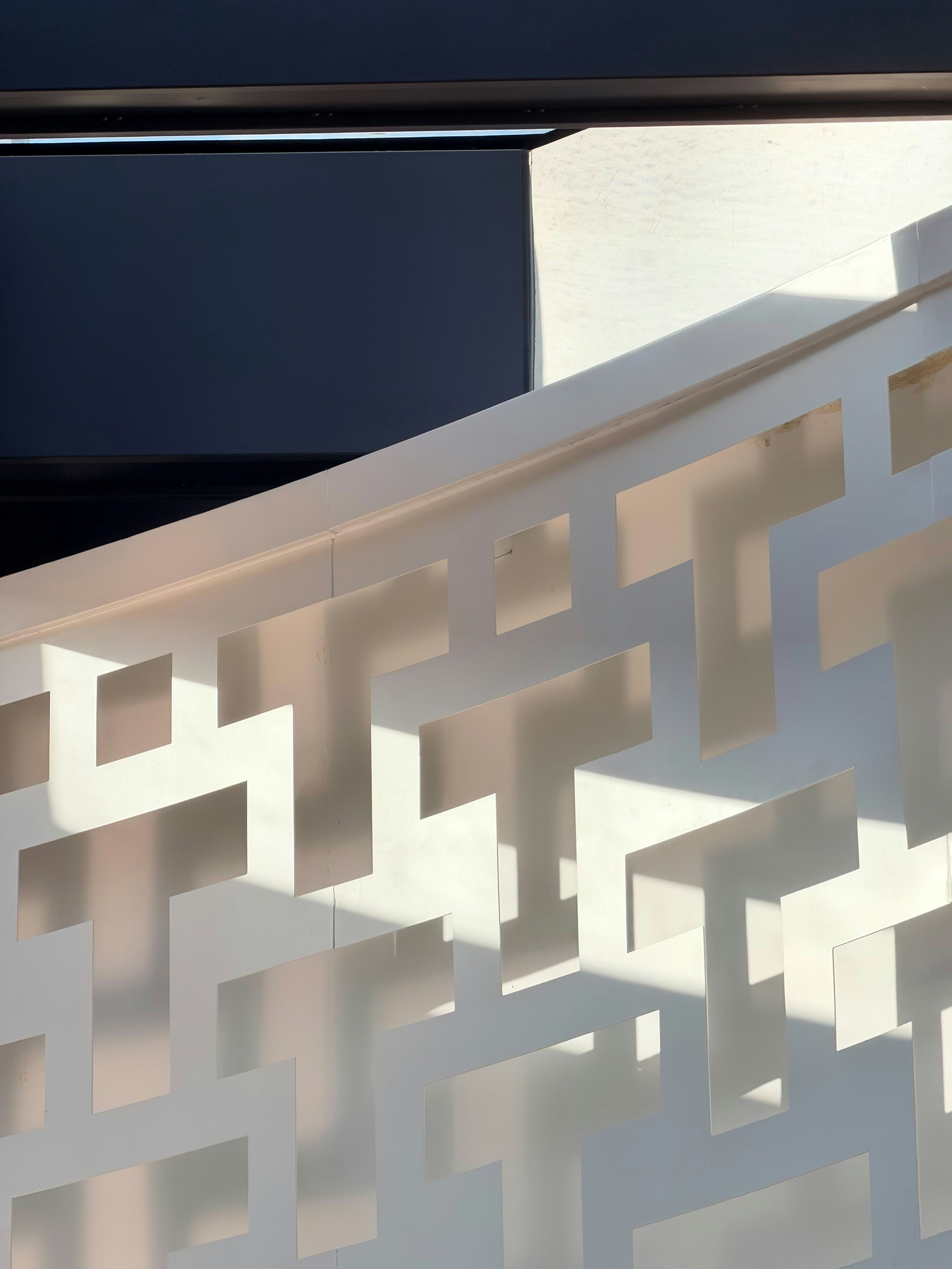 Shadowed lattice: Geometry of light on a perforated balcony panel