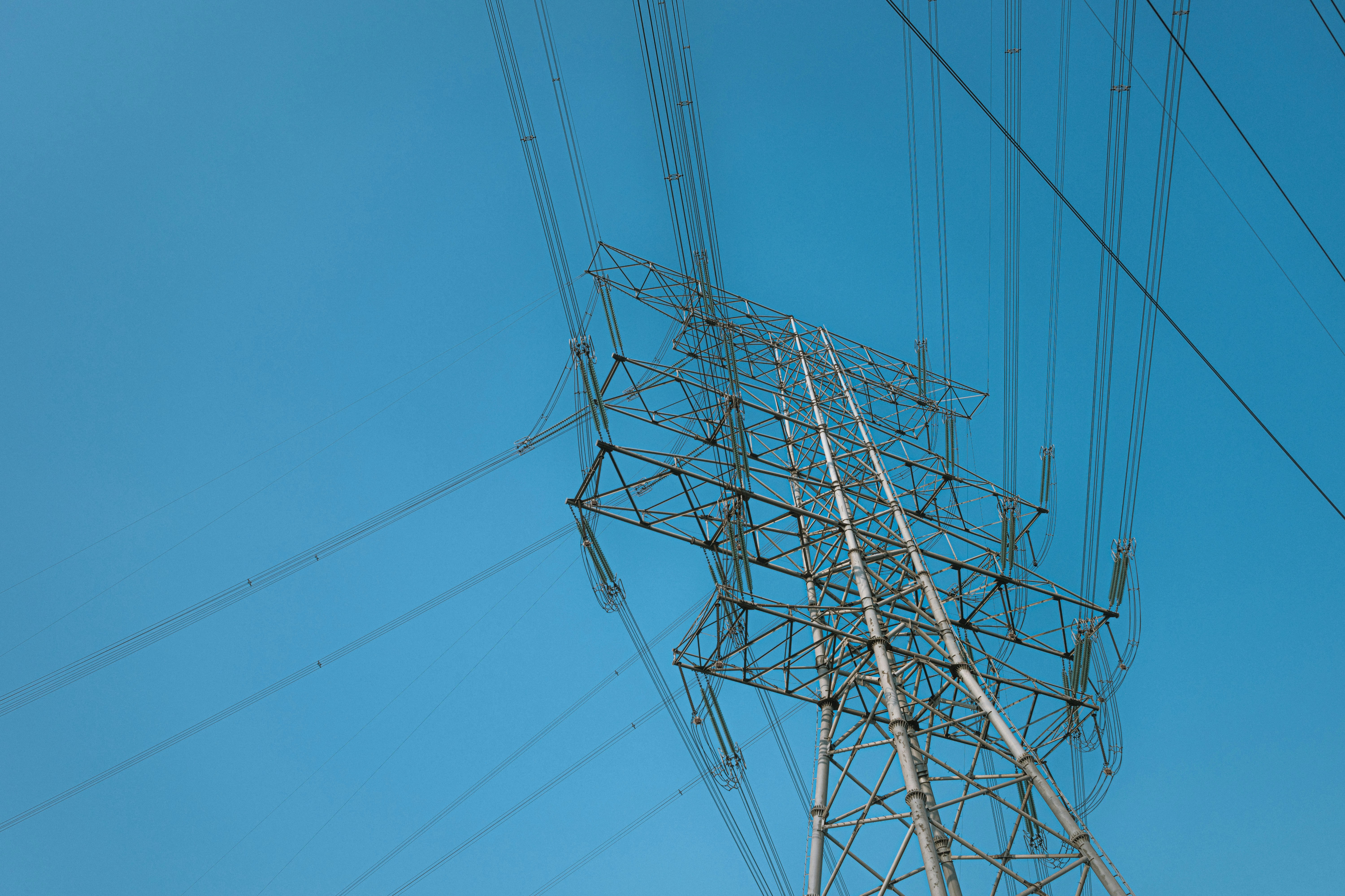 Skyward Lattice: a steel tower tracing lines toward a crisp blue expanse