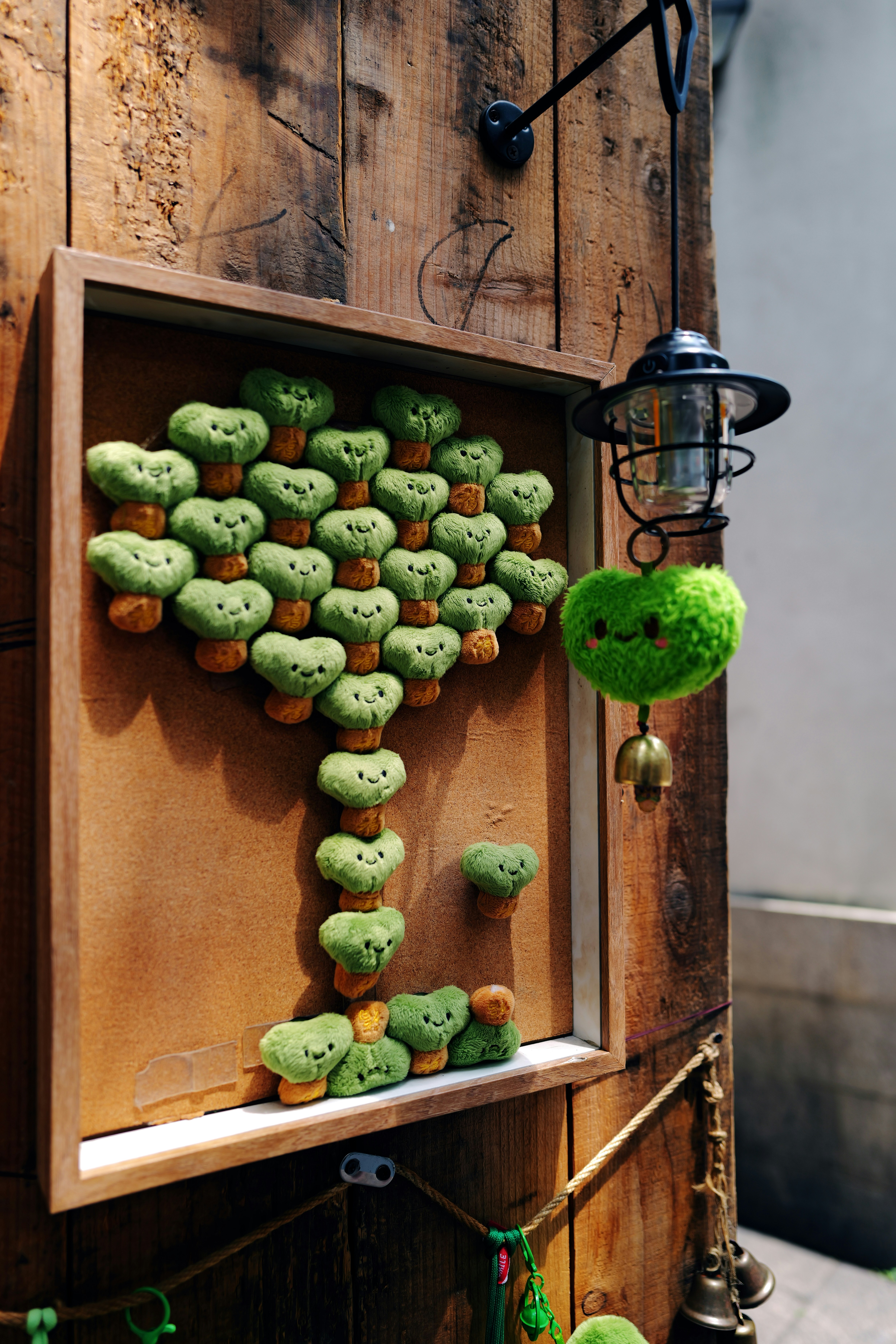 Green Cloud of Plush: A Cozy Wall-Tied Orchard of Soft Faces