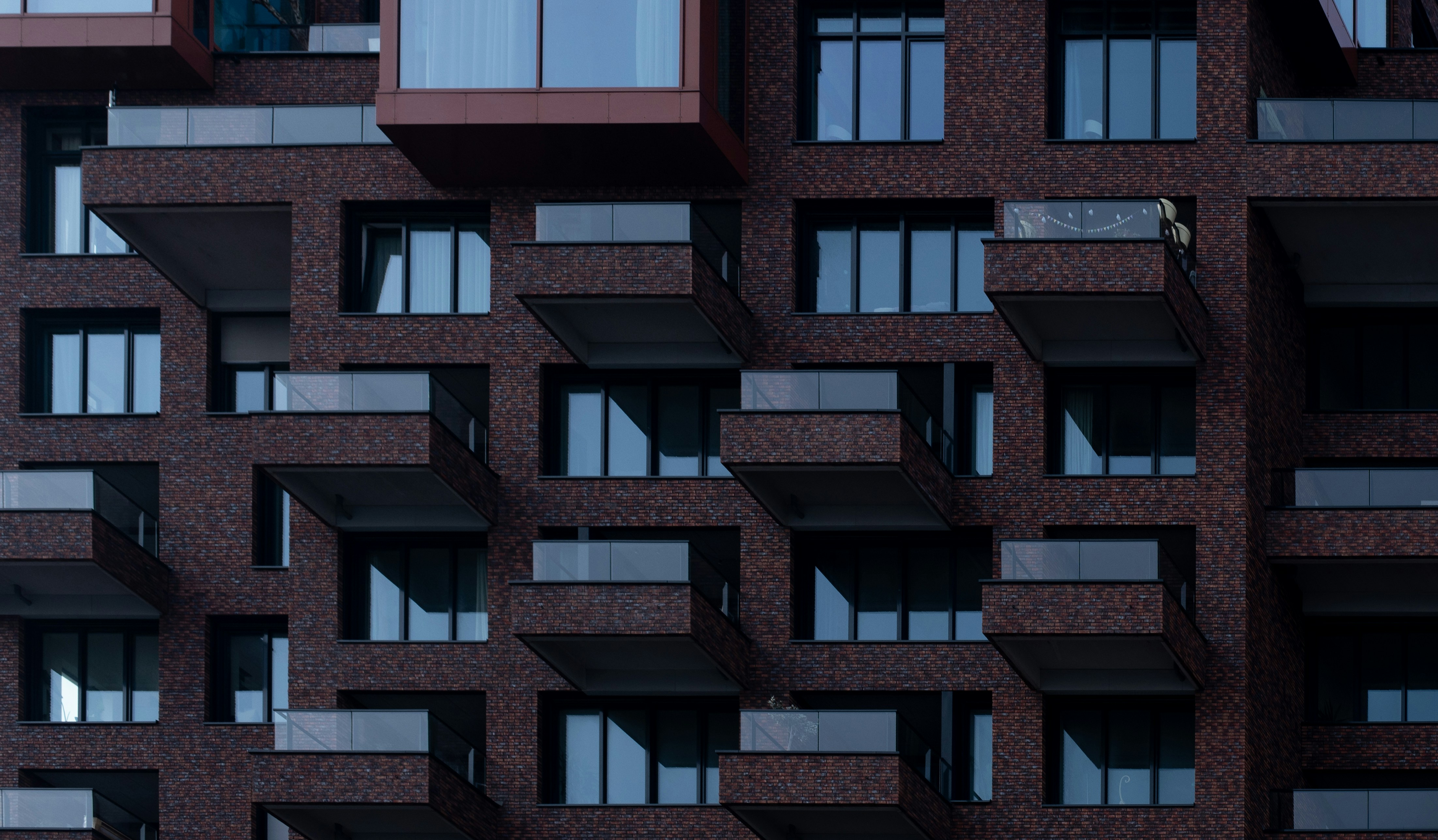 Brickwork Geometry: Repeating Balconies in Evening Light