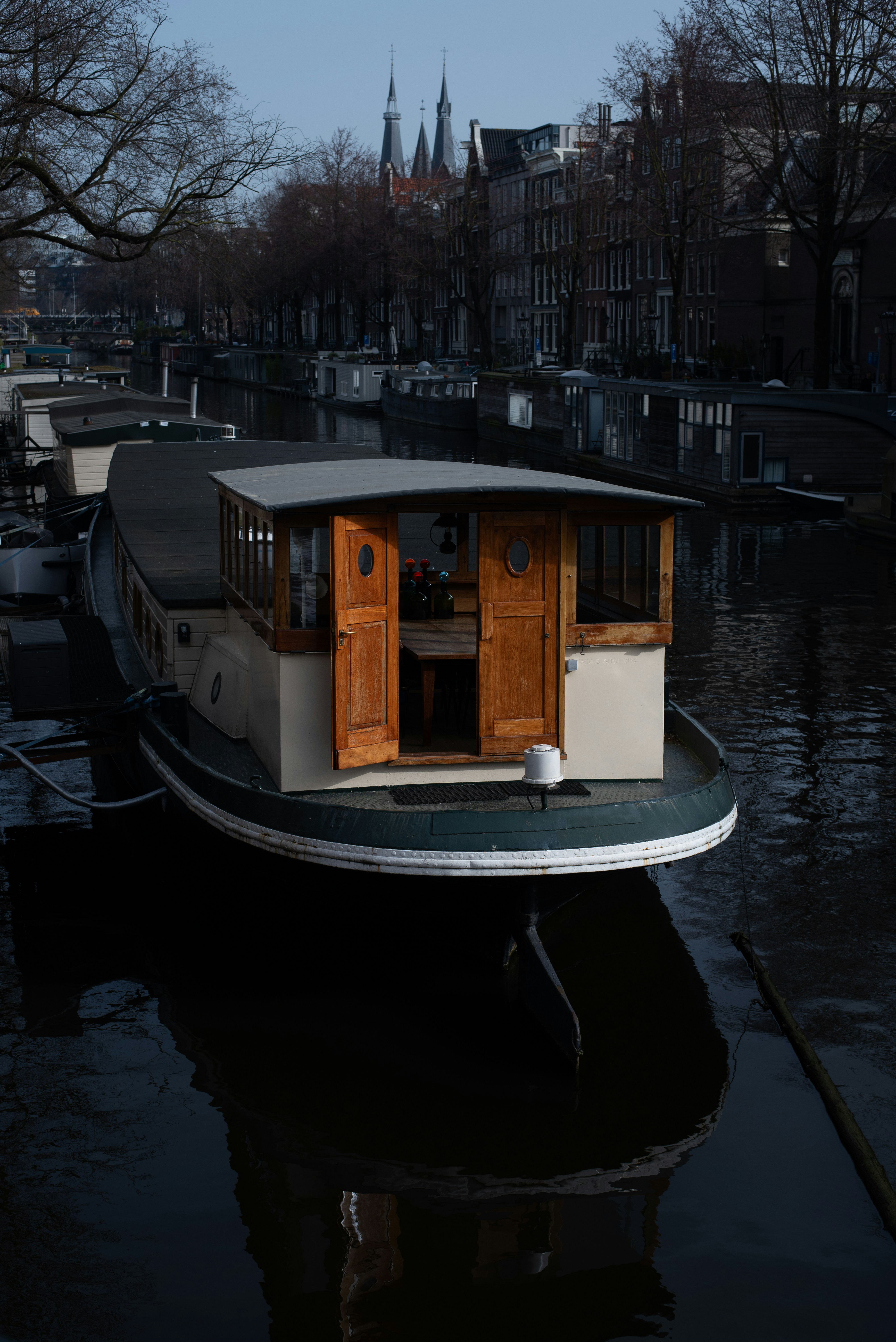 Houseboat at the Delft Canals: Warm Wood Doors Amid Evening Calm
