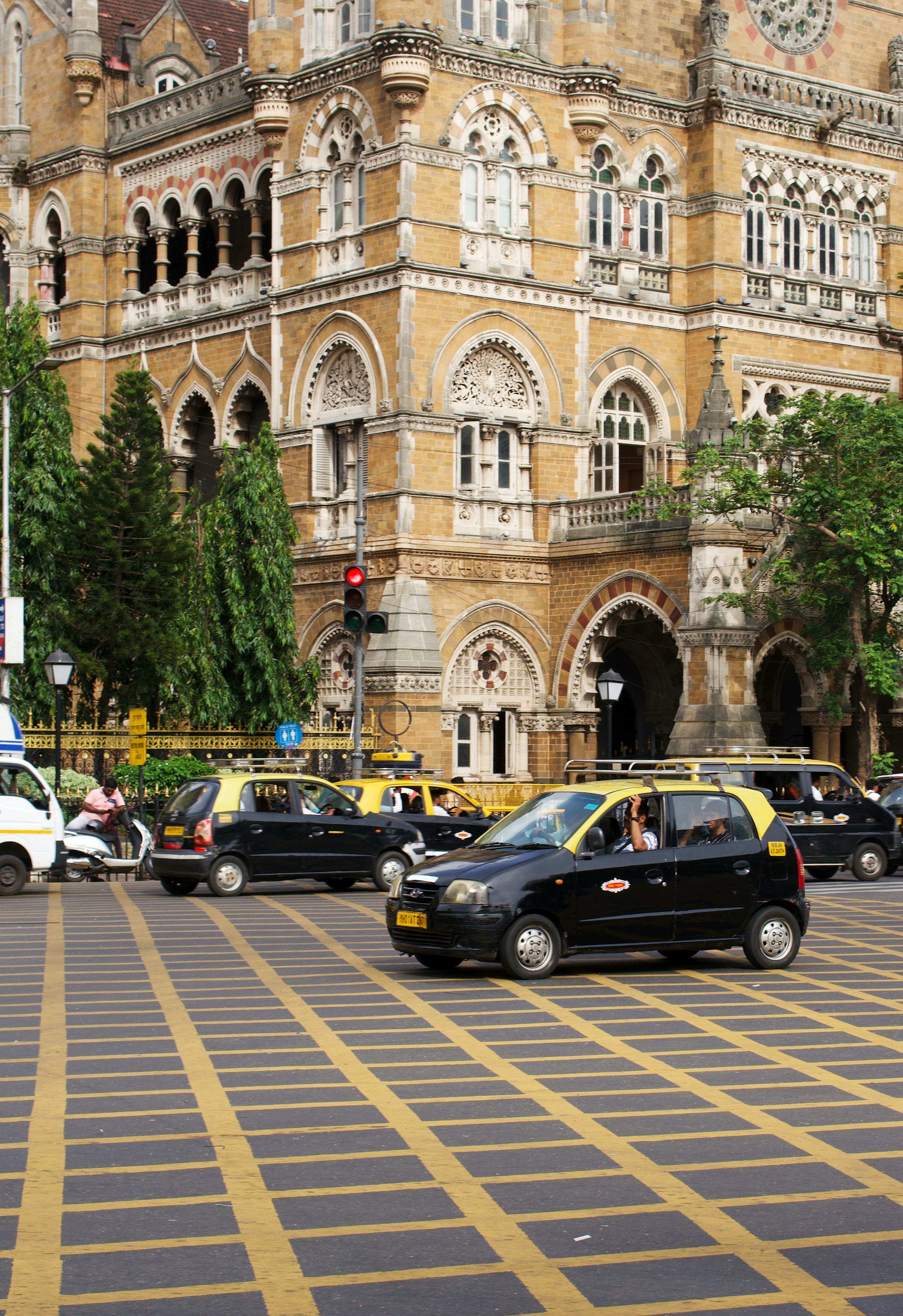 Taxi Parade in Front of Ornate European Facade