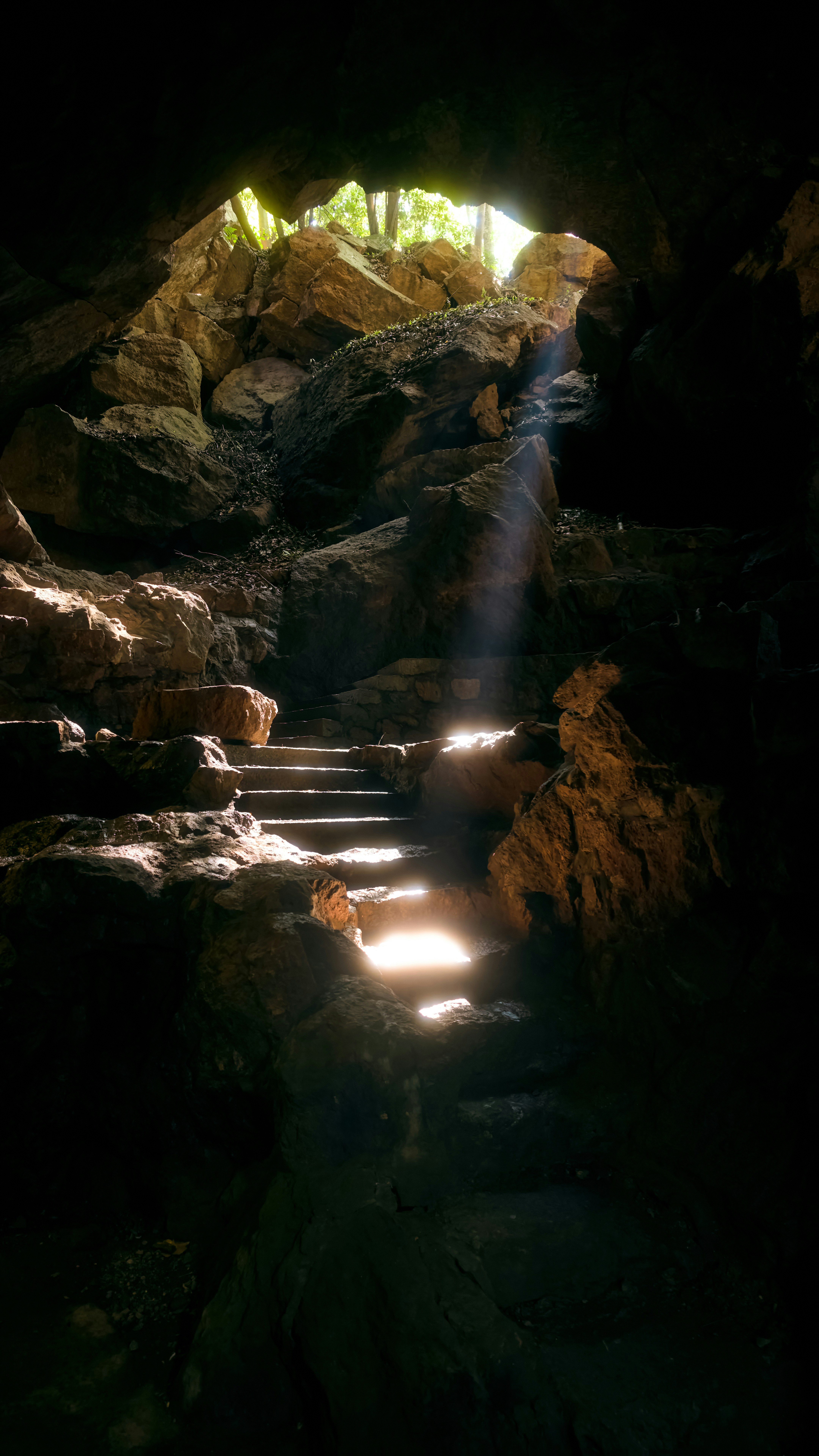 Sunlit Gap: A Quiet Staircase Emerges from the Cave
