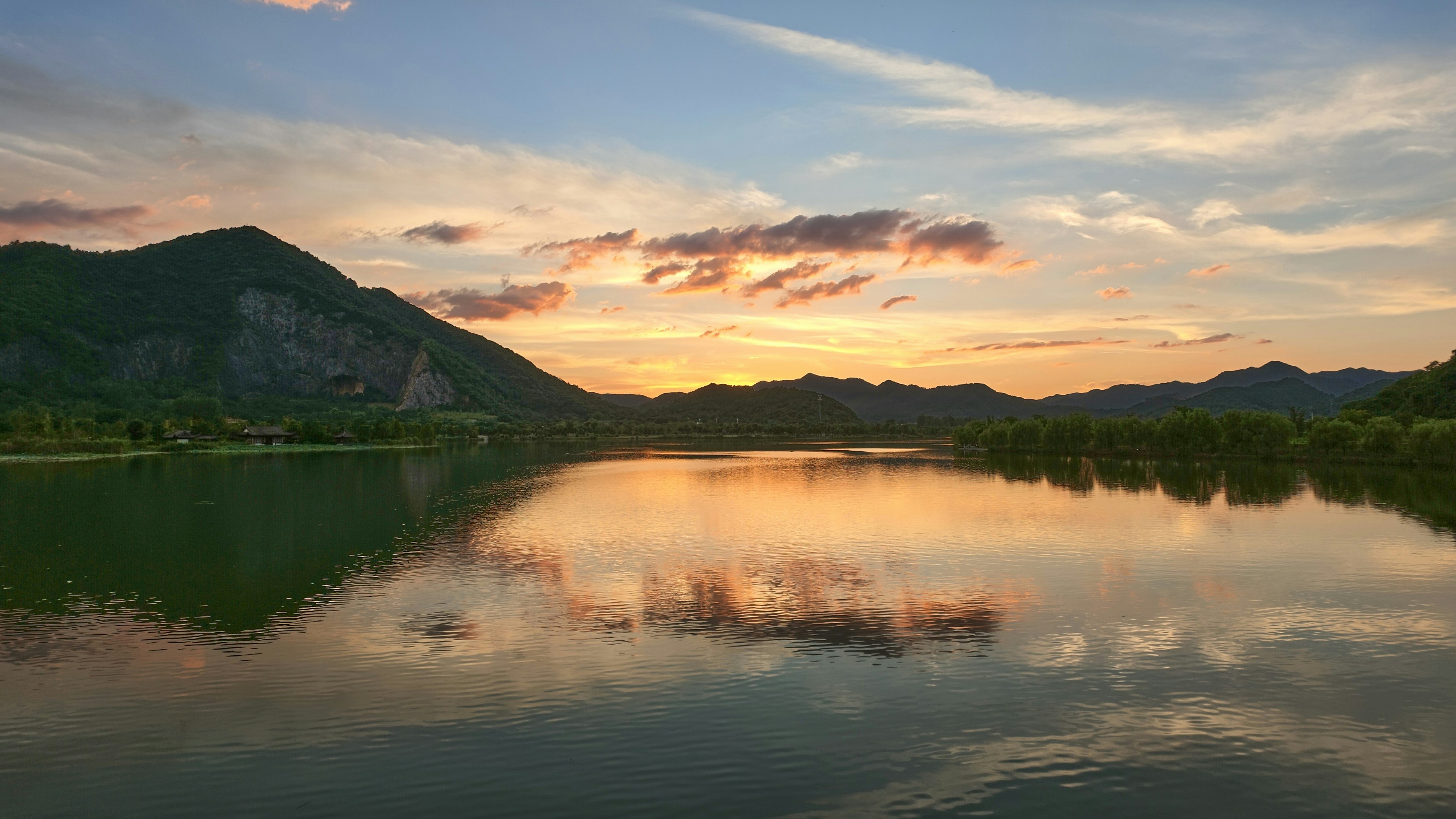 Sunset Over a Serene River Canyon