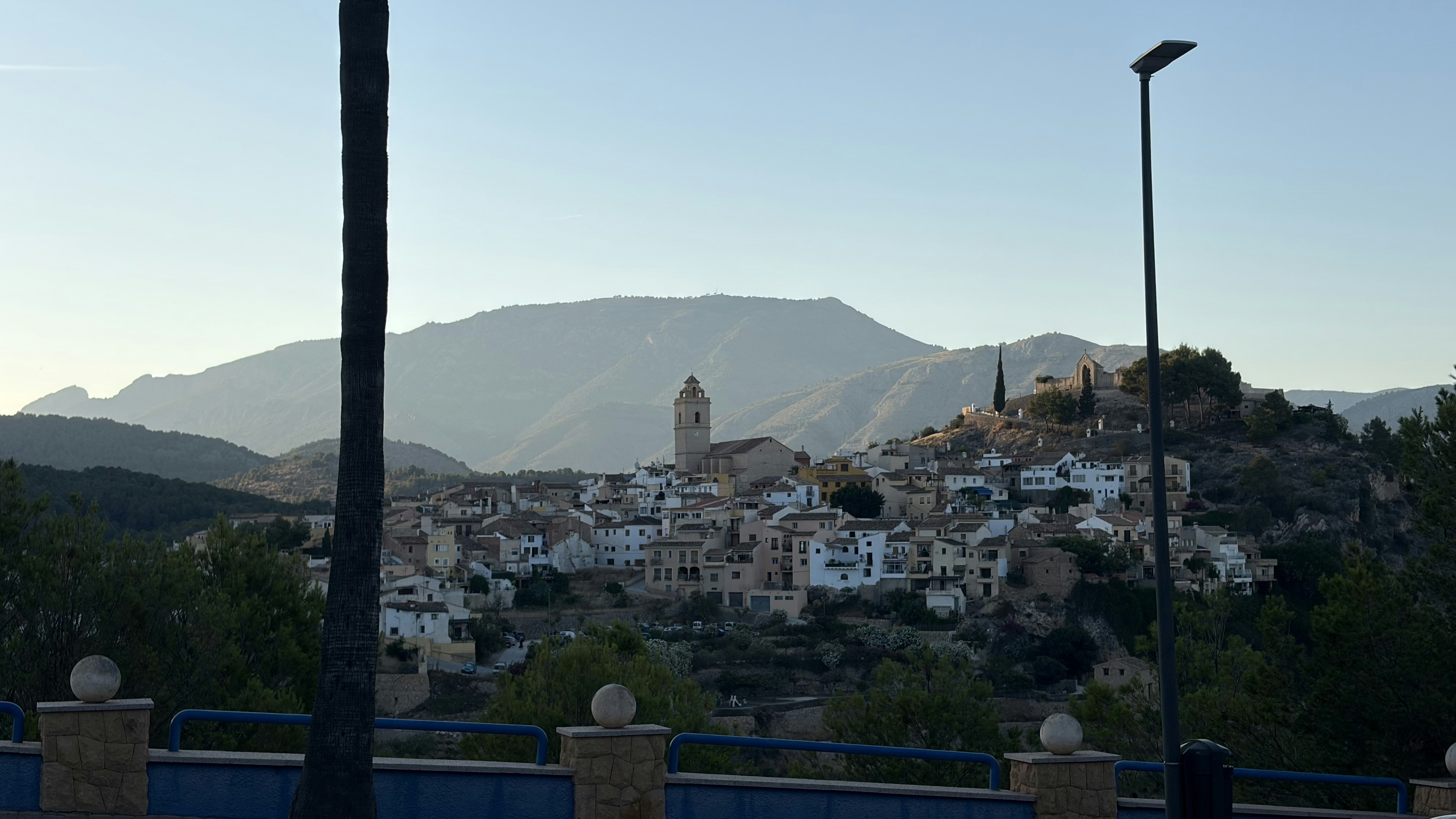 Hillside Village Under a Clear Ridge