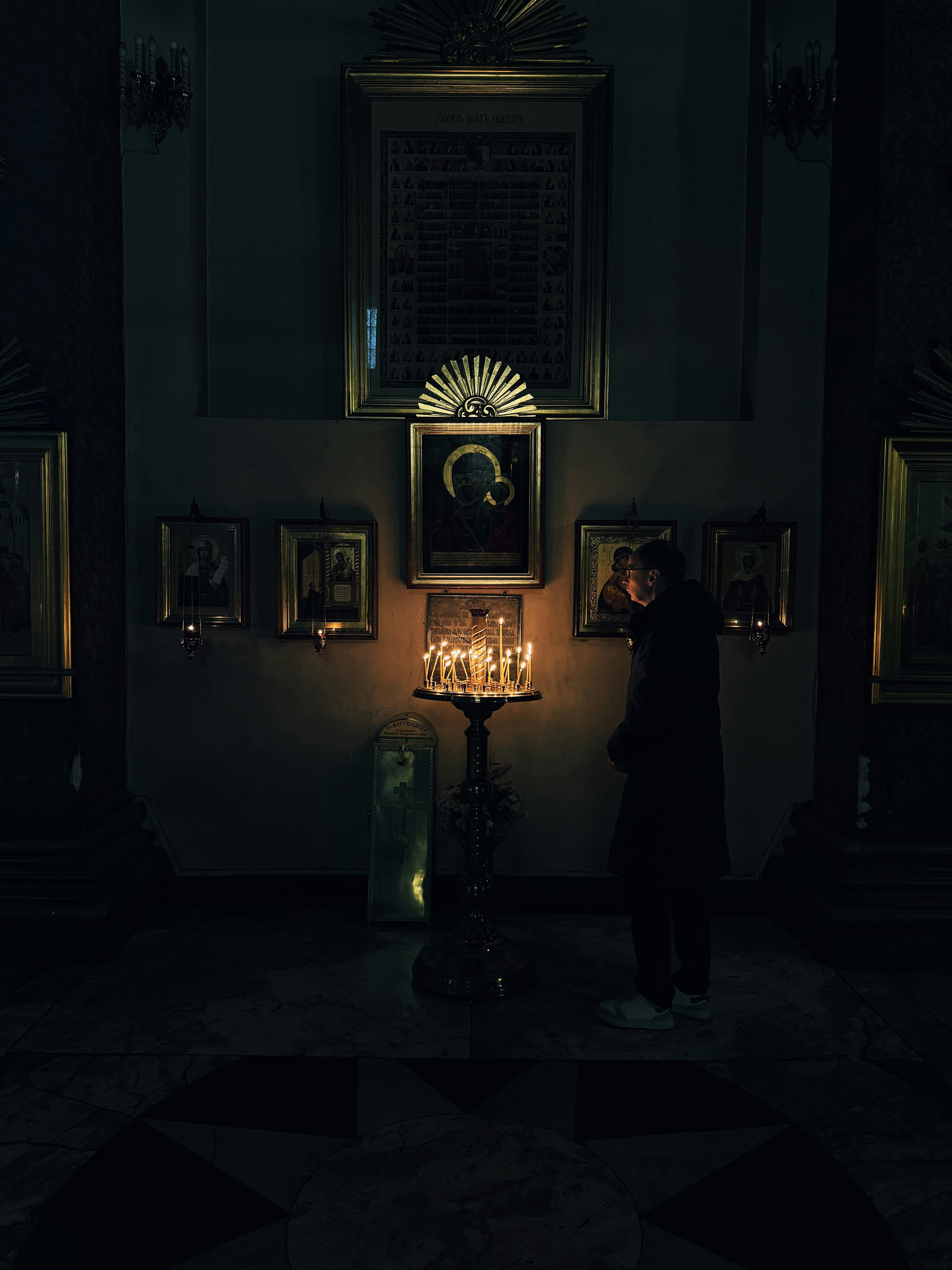Candles in the Dark: A Silent Portrait in a Sacred Hall