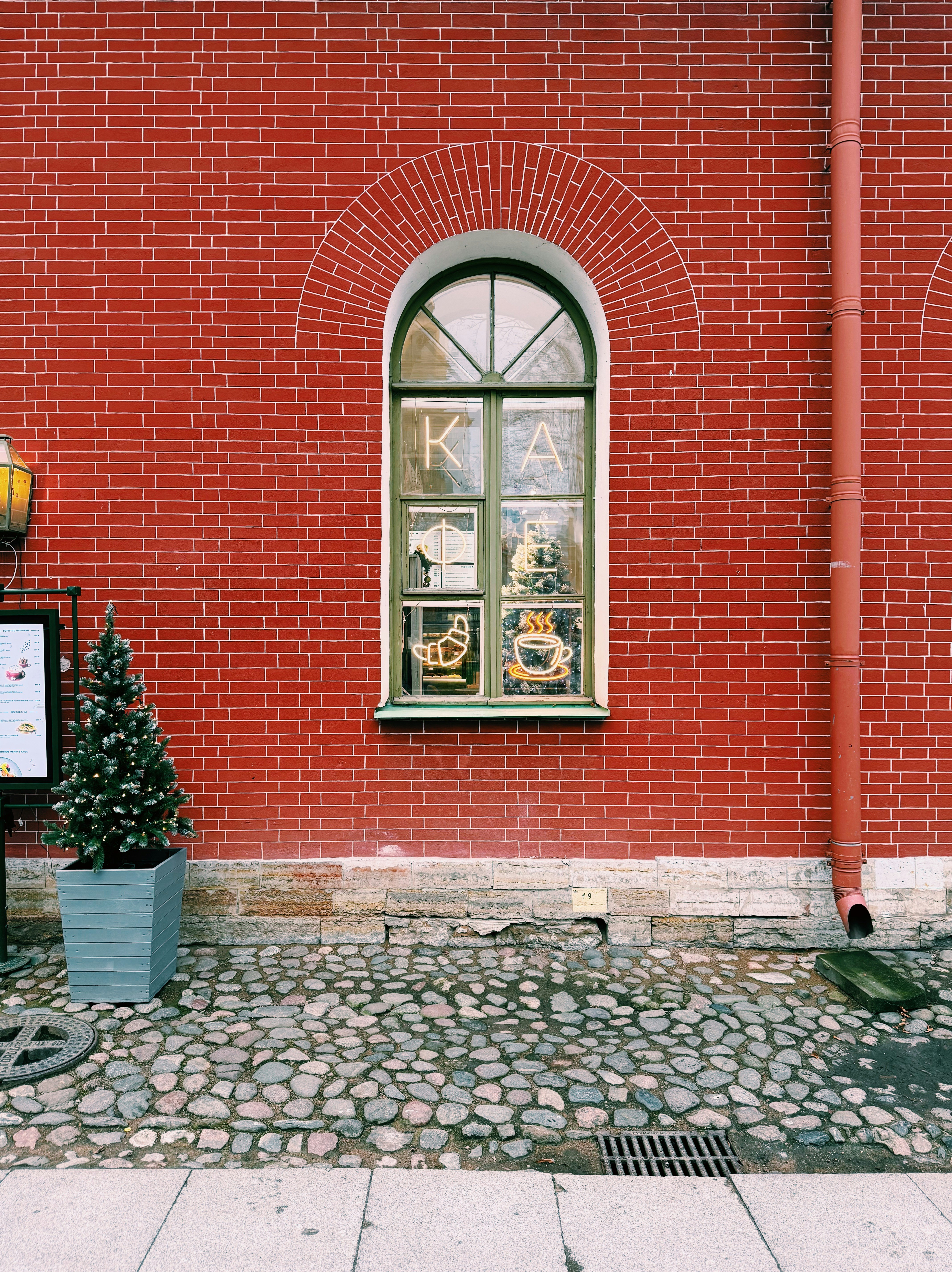 Brick Arch Window Amid Cobblestone Street
