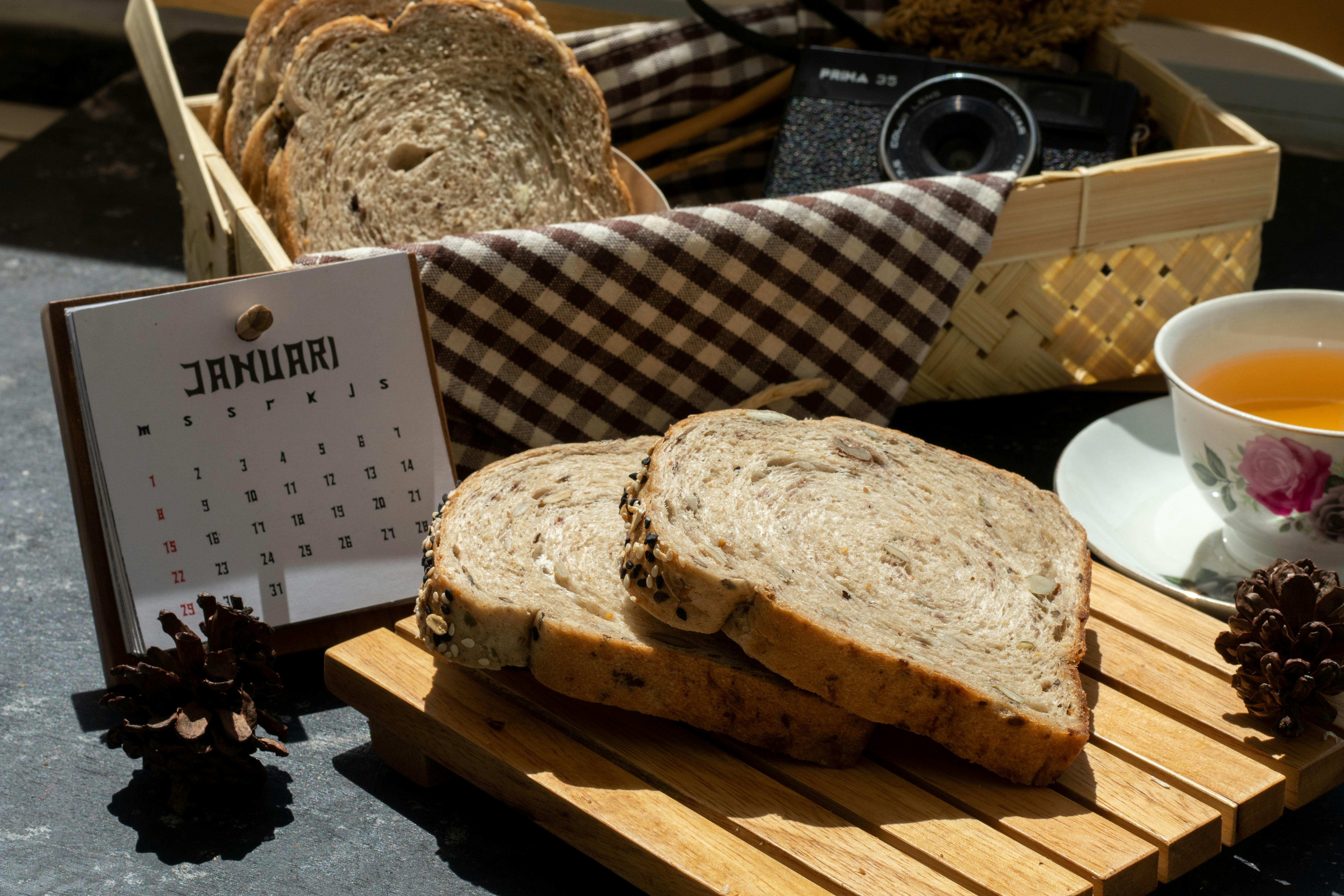 Slice by Slice: Rustic Sourdough on a Wooden Board with Vintage Camera Ambience