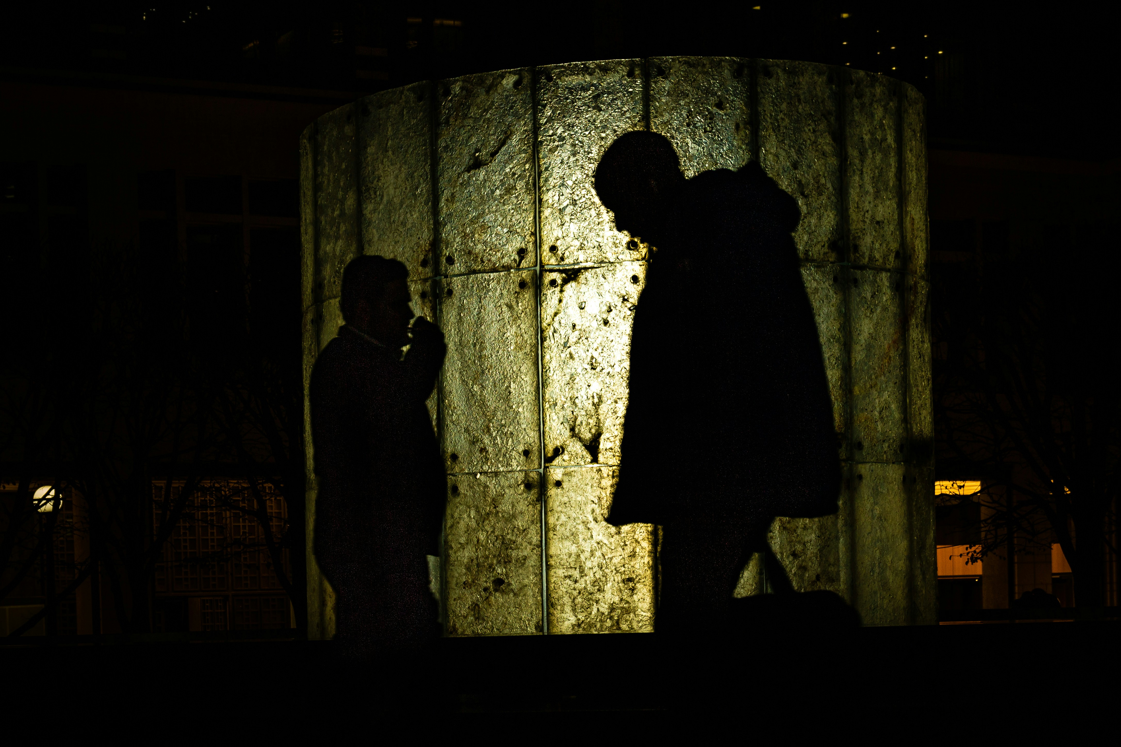 Shadow Dialog by the Illuminated Wall