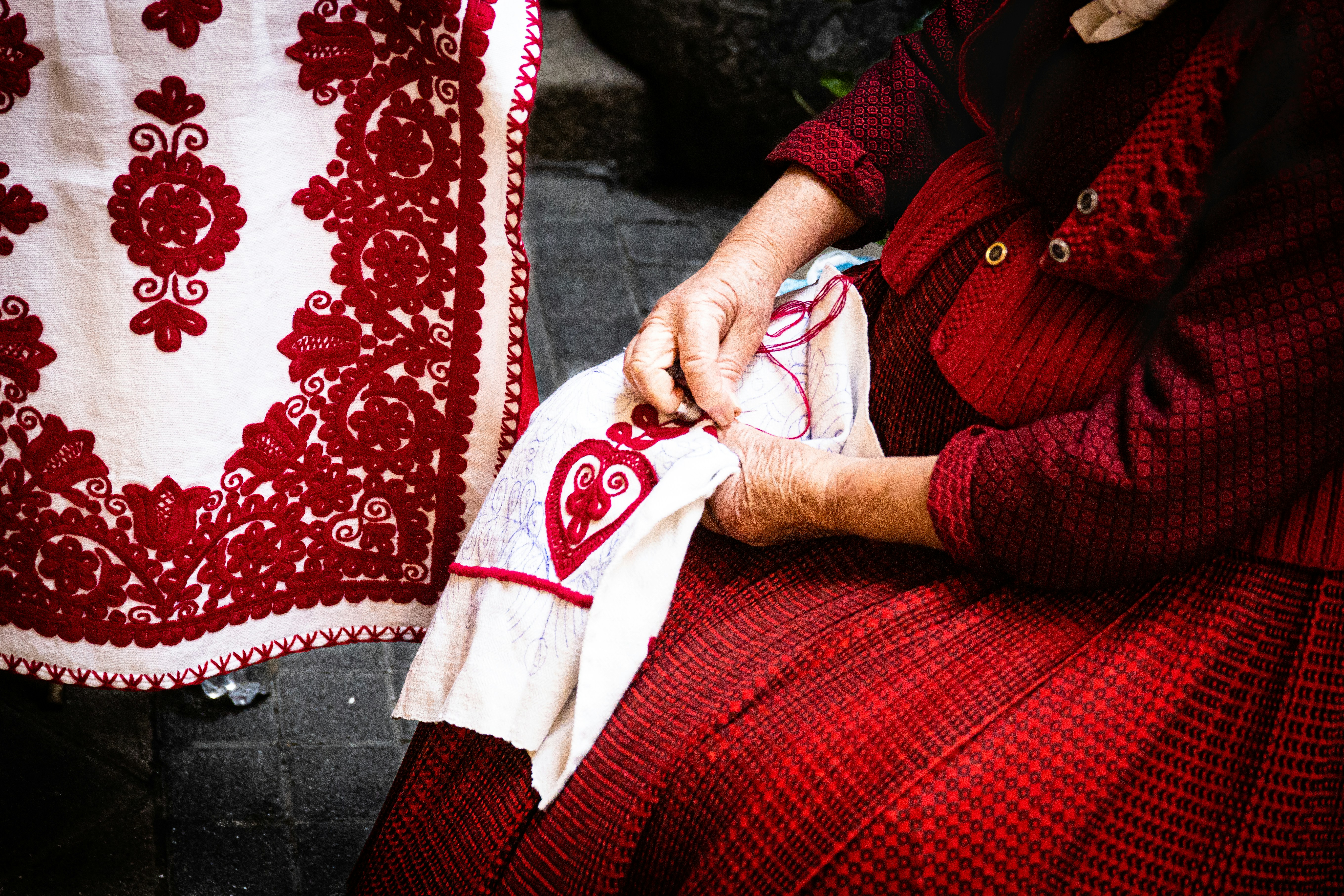 Hands at Work: Embroidered Red Threads in a Textile Ritual