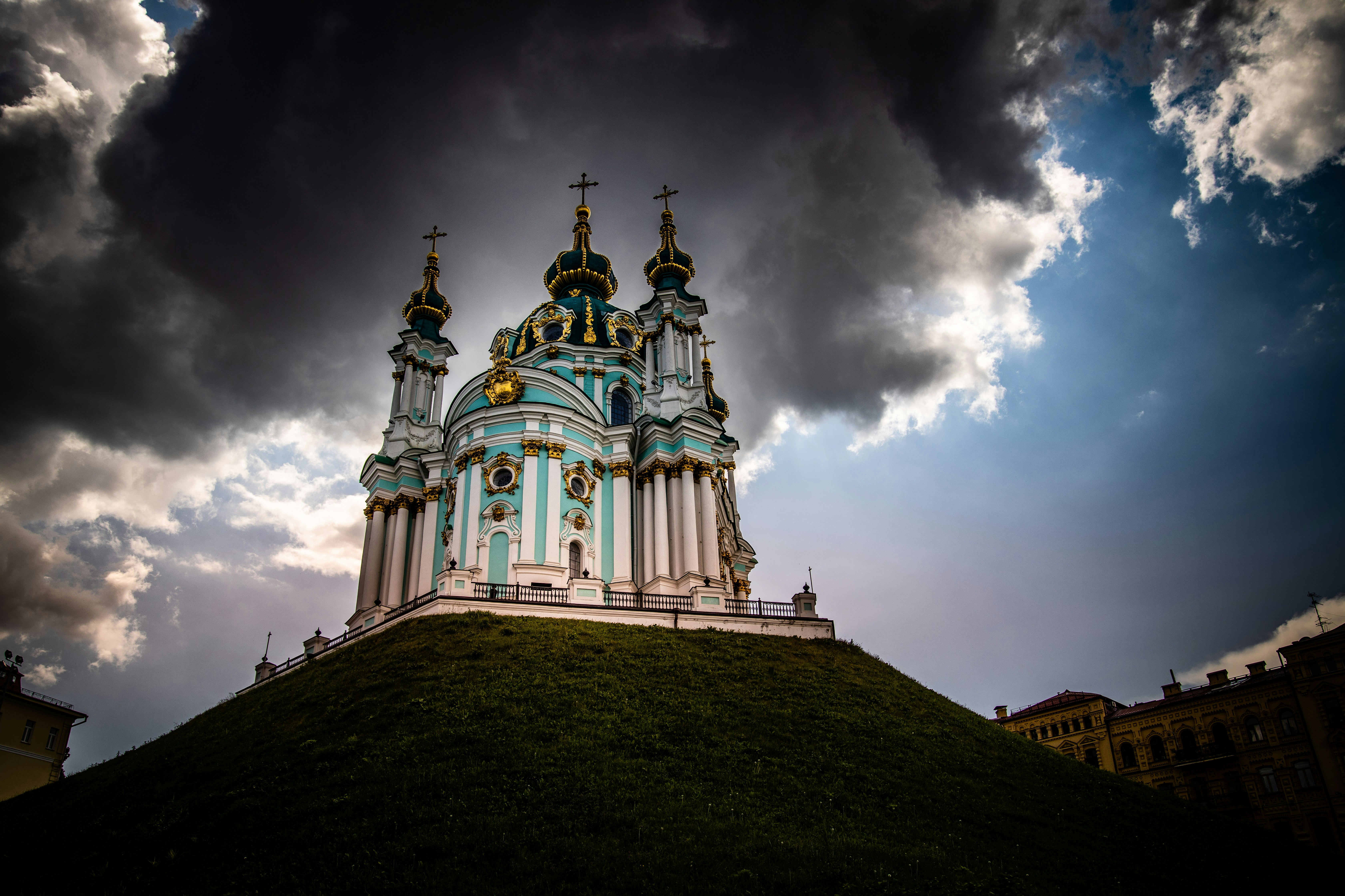 Azure Domes atop the Hill: A Baroque Cathedral Reaching Toward Stormy Skies