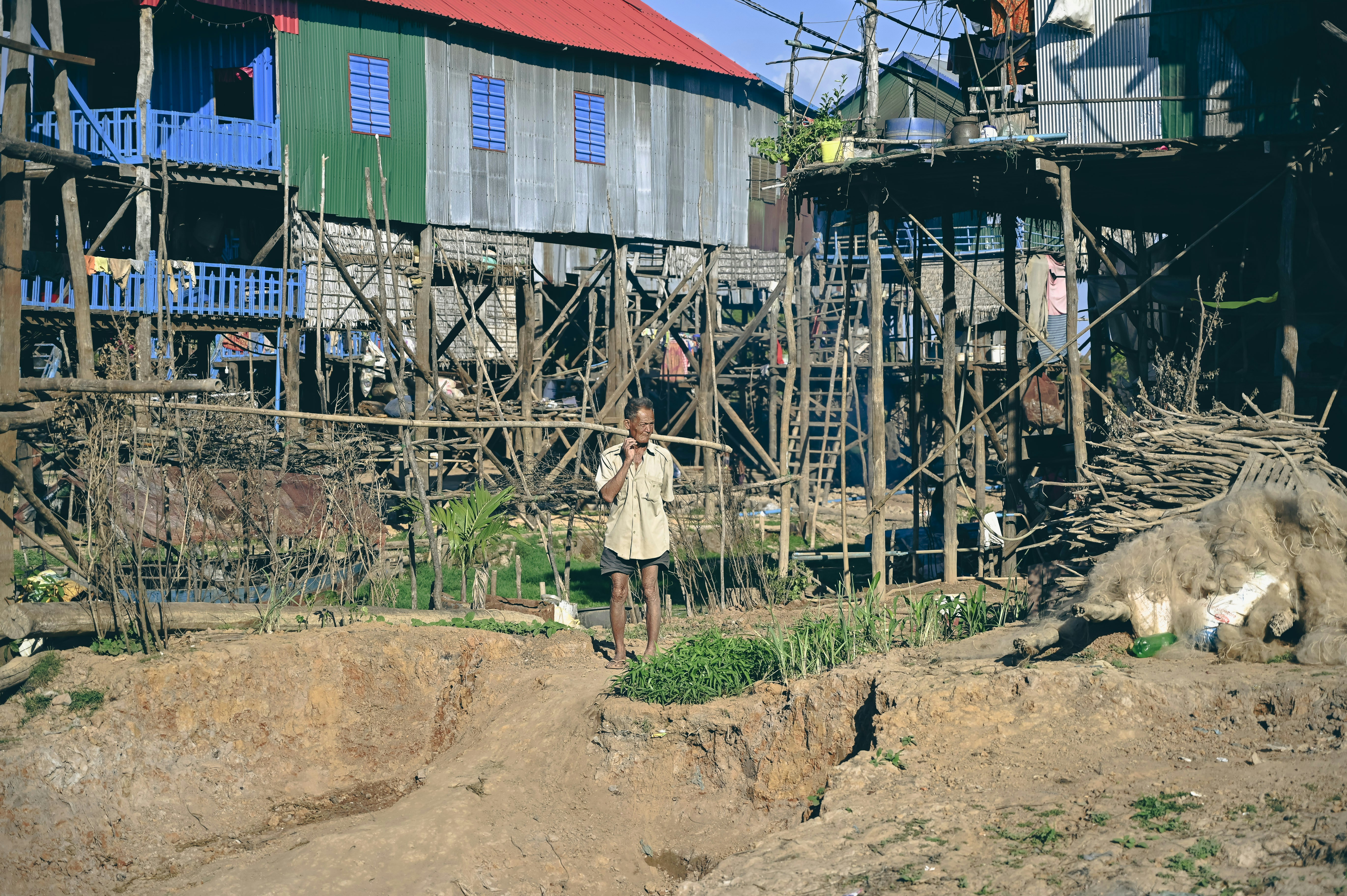 Child in a Villager’s Setting: A Quiet Moment Amid Wooden Homes