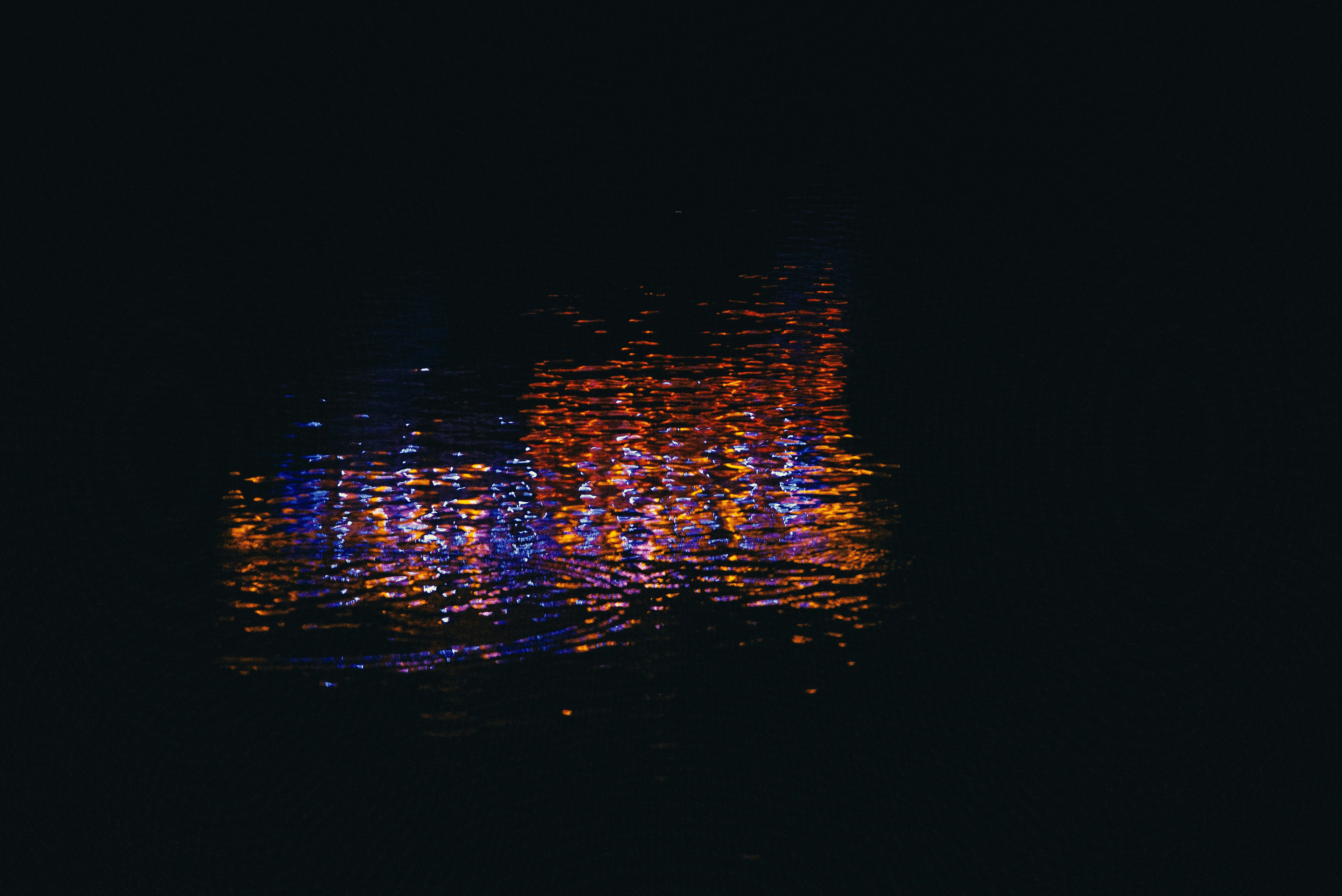 Neon Ripples on Dark Water