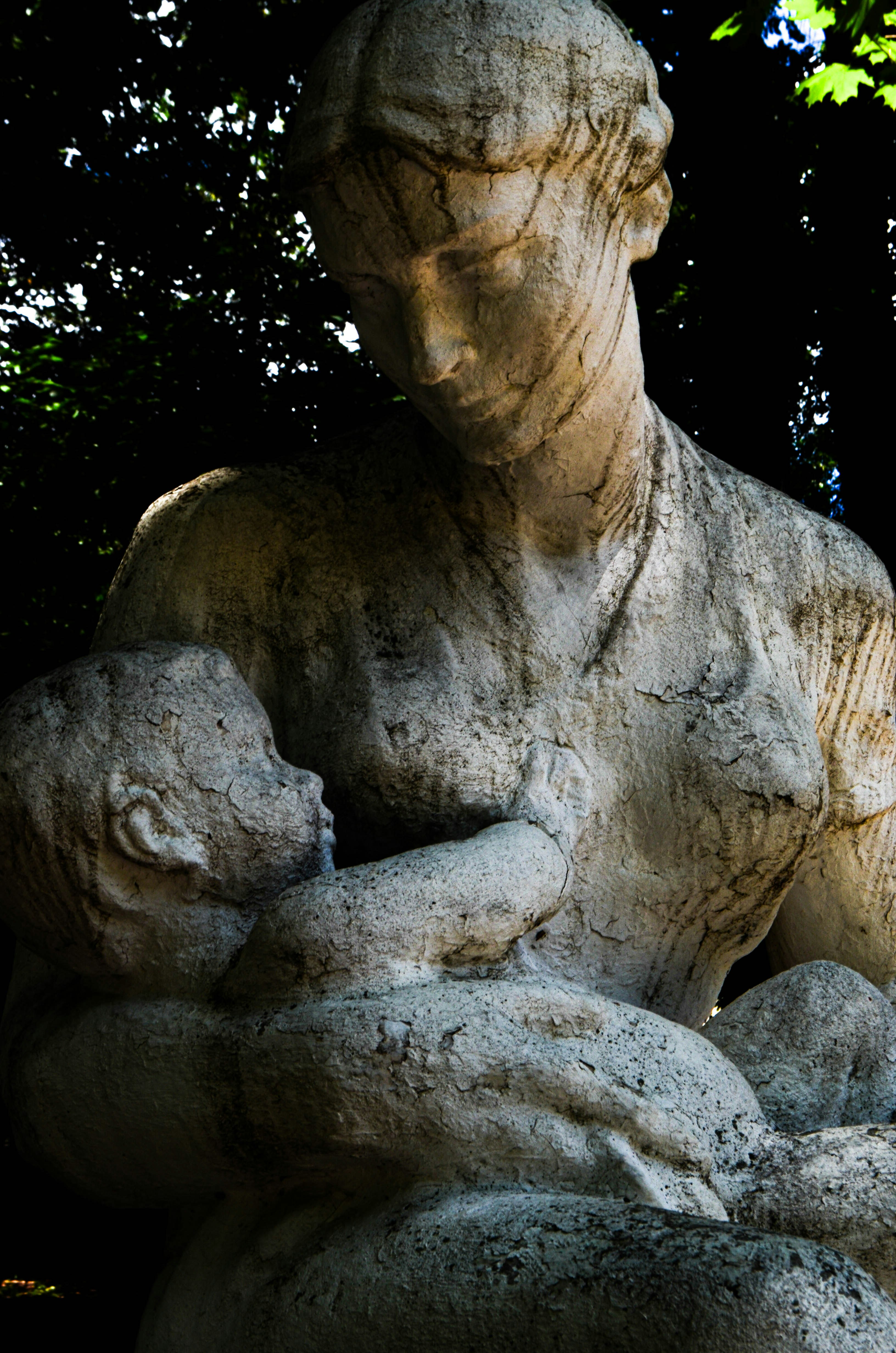 Stone Mother and Child: Quiet Bond in the Garden Quietness