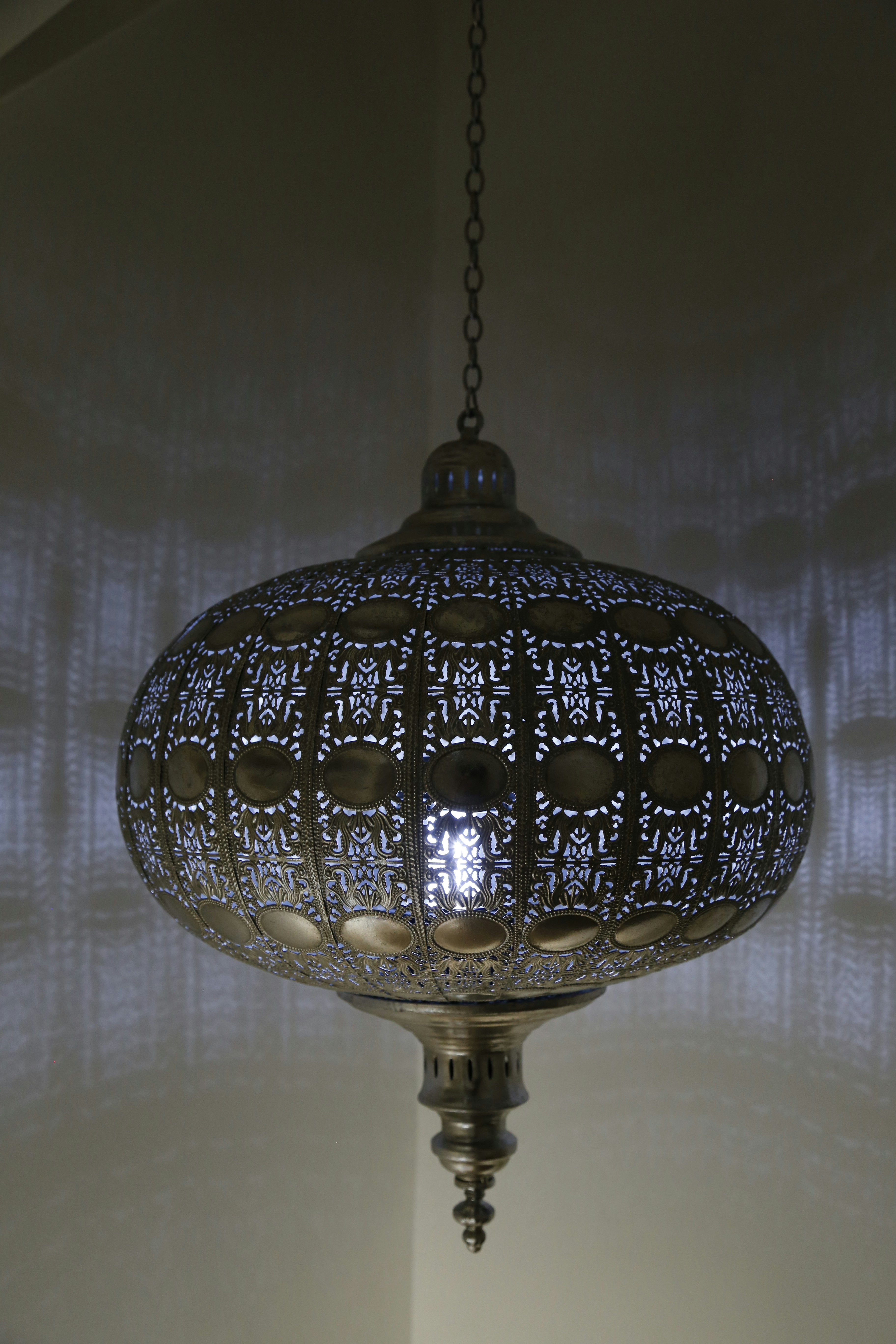 Latticed Lantern: A Metal Pendant Illuminates the Quiet Room