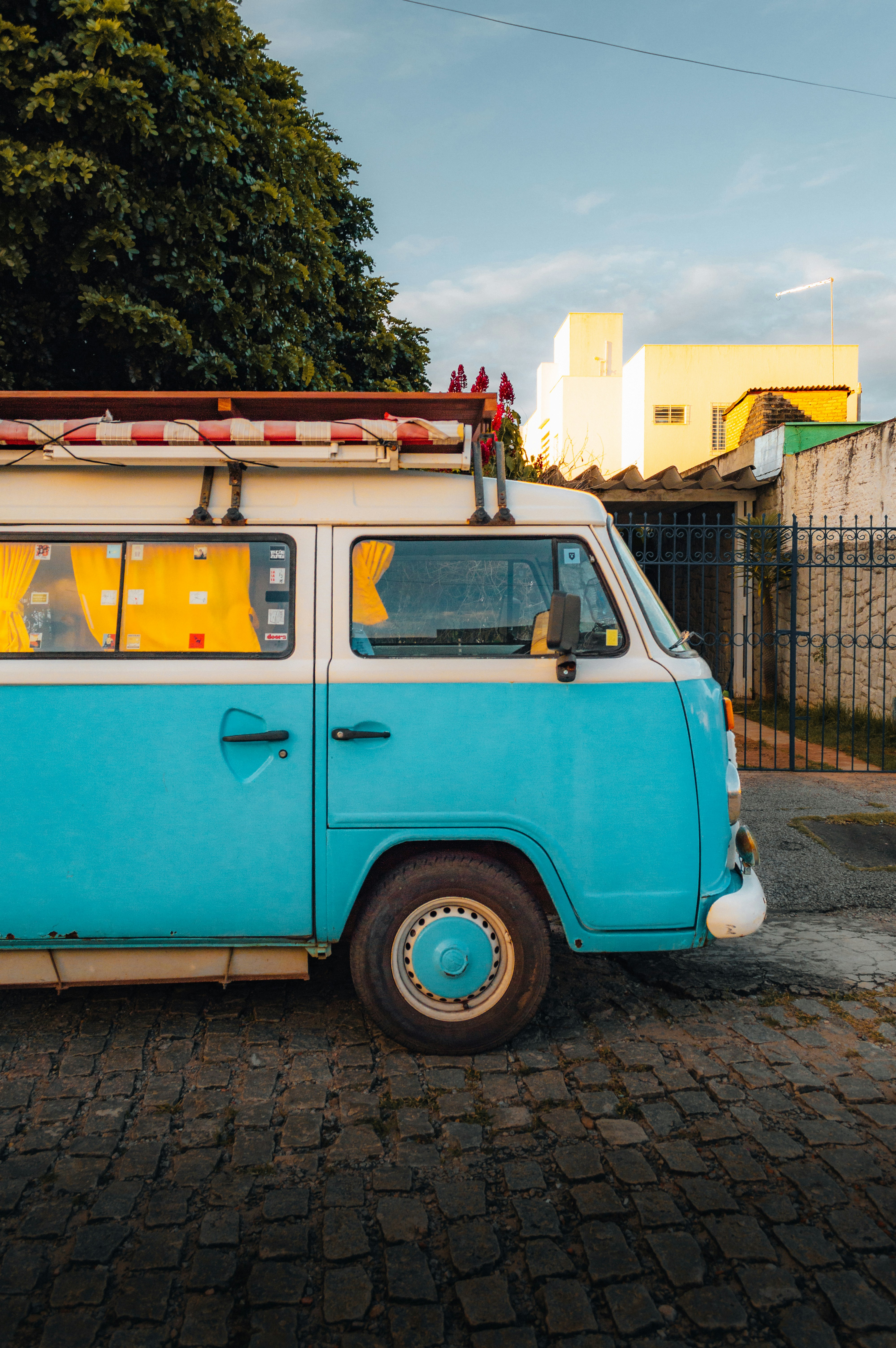 Azure Microbus on Cobblestones at Dusk