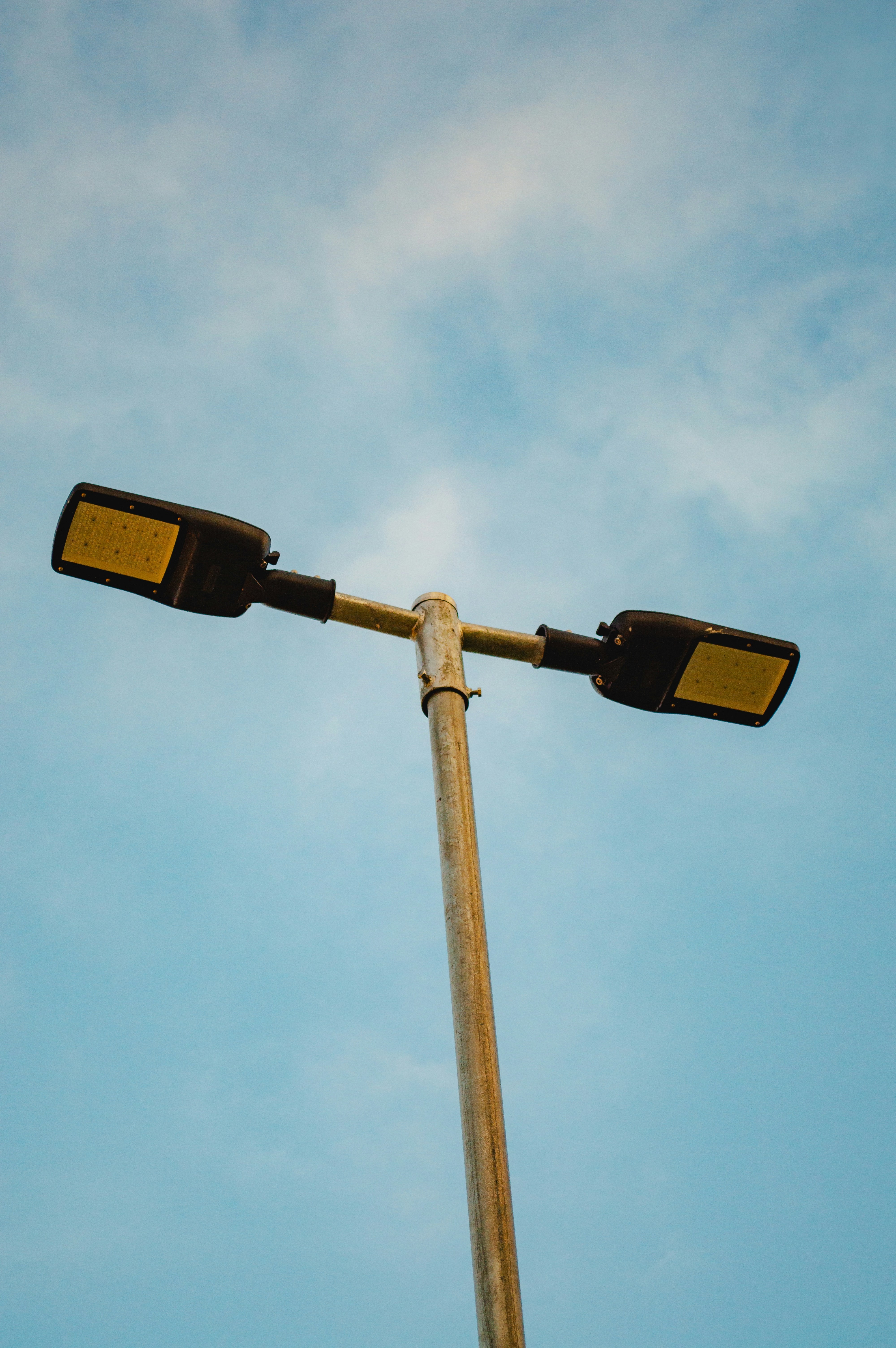 Pole-Top Dual LED Lights Against a Clear Sky