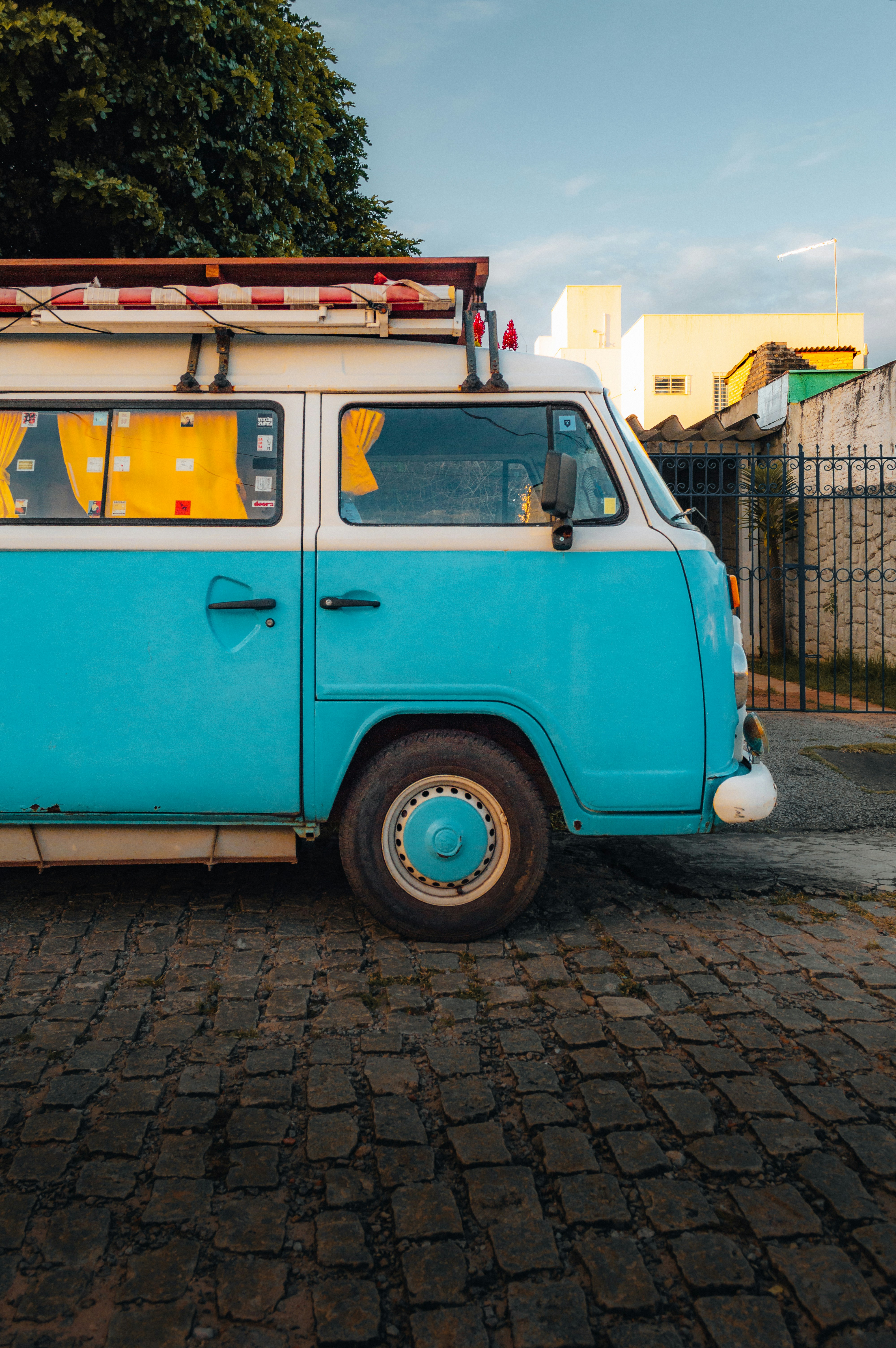 Aqua Classic: Front-Quarter of a Vintage Van on Cobblestones