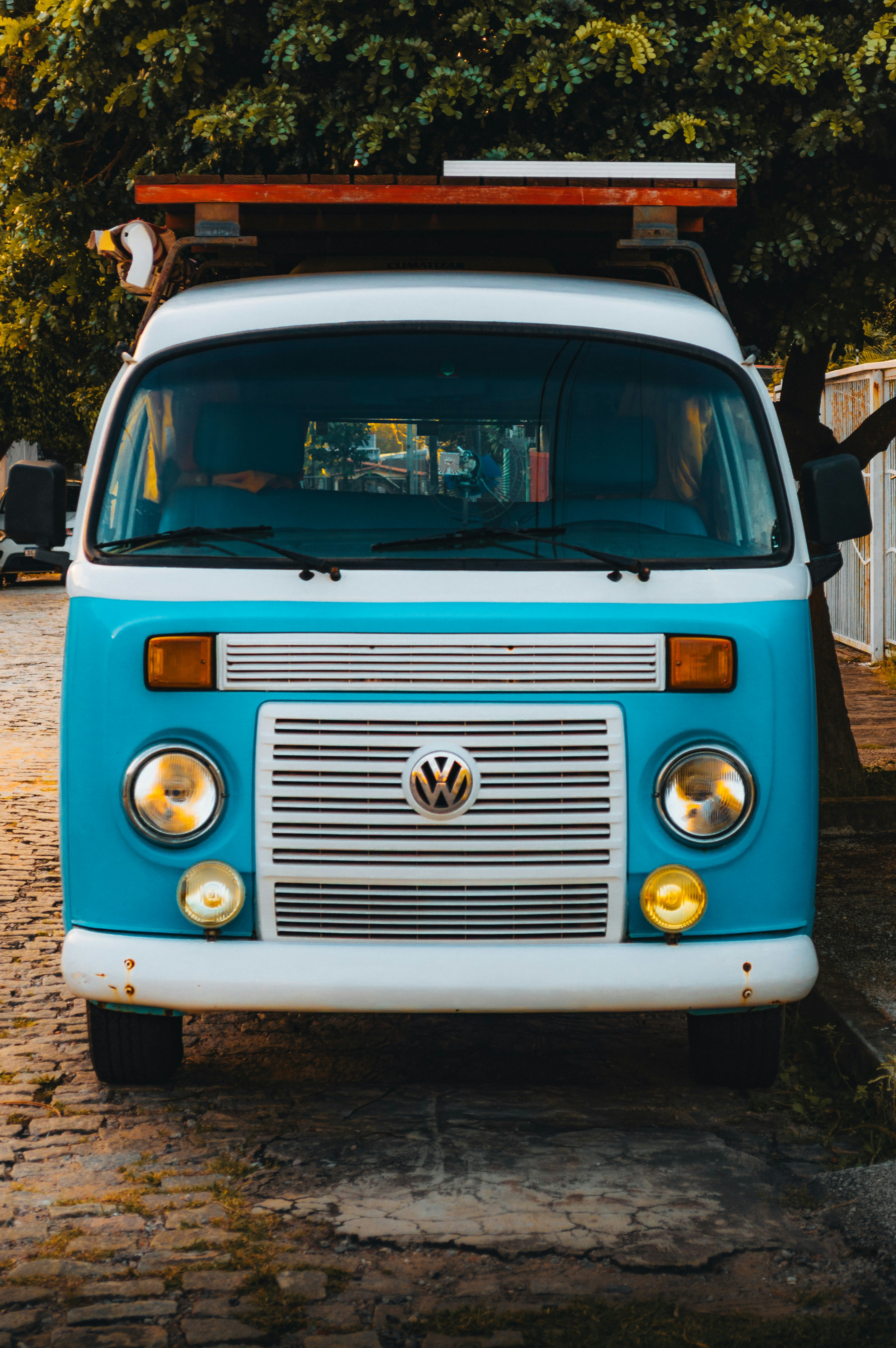 Front-View of a Retro Volkswagen Van: A Coastal Blue Classic with Chrome Grill