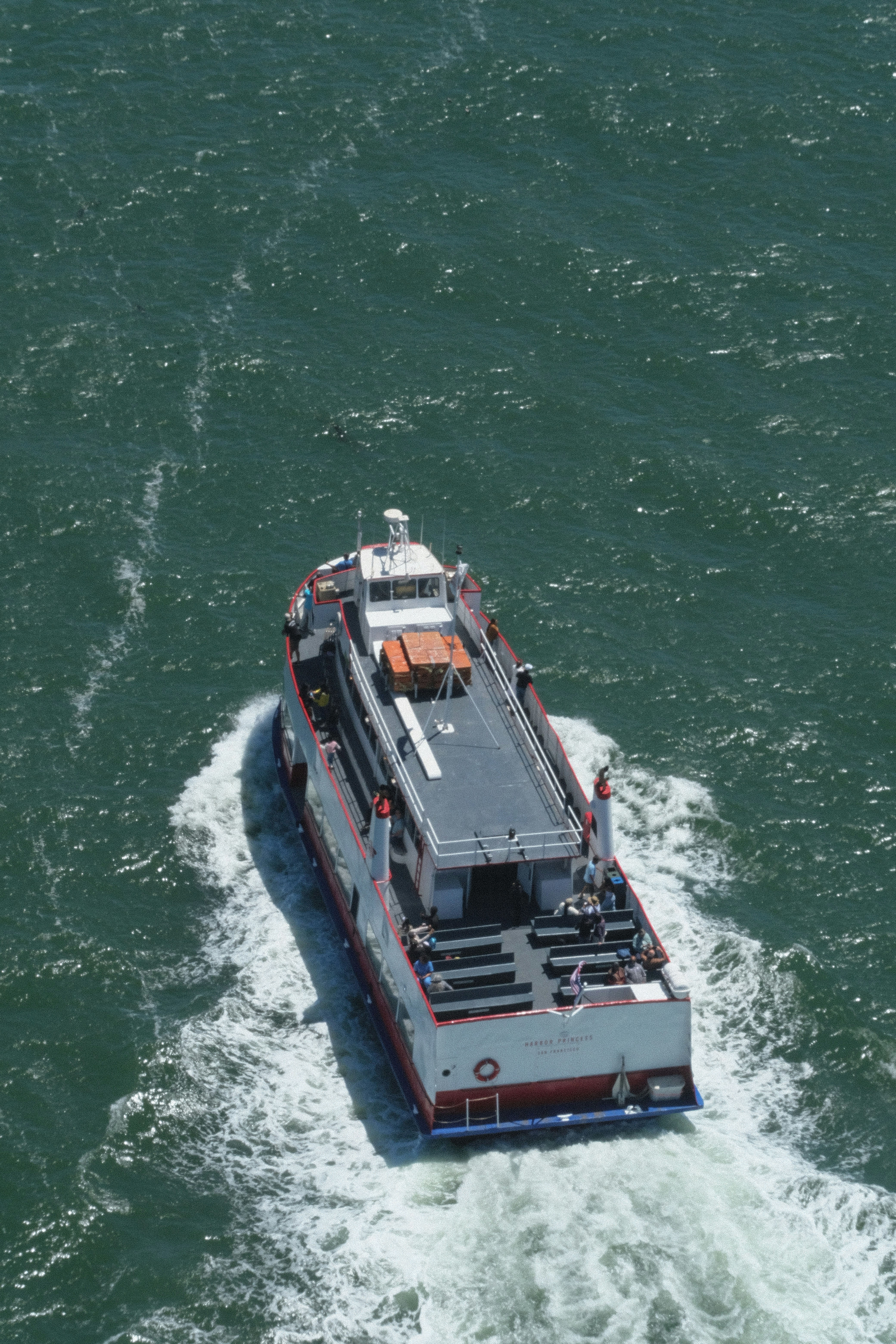 Overtaken by a Workboat: Aerial View of a Buoyant Ferry Pushing Through Seafoam