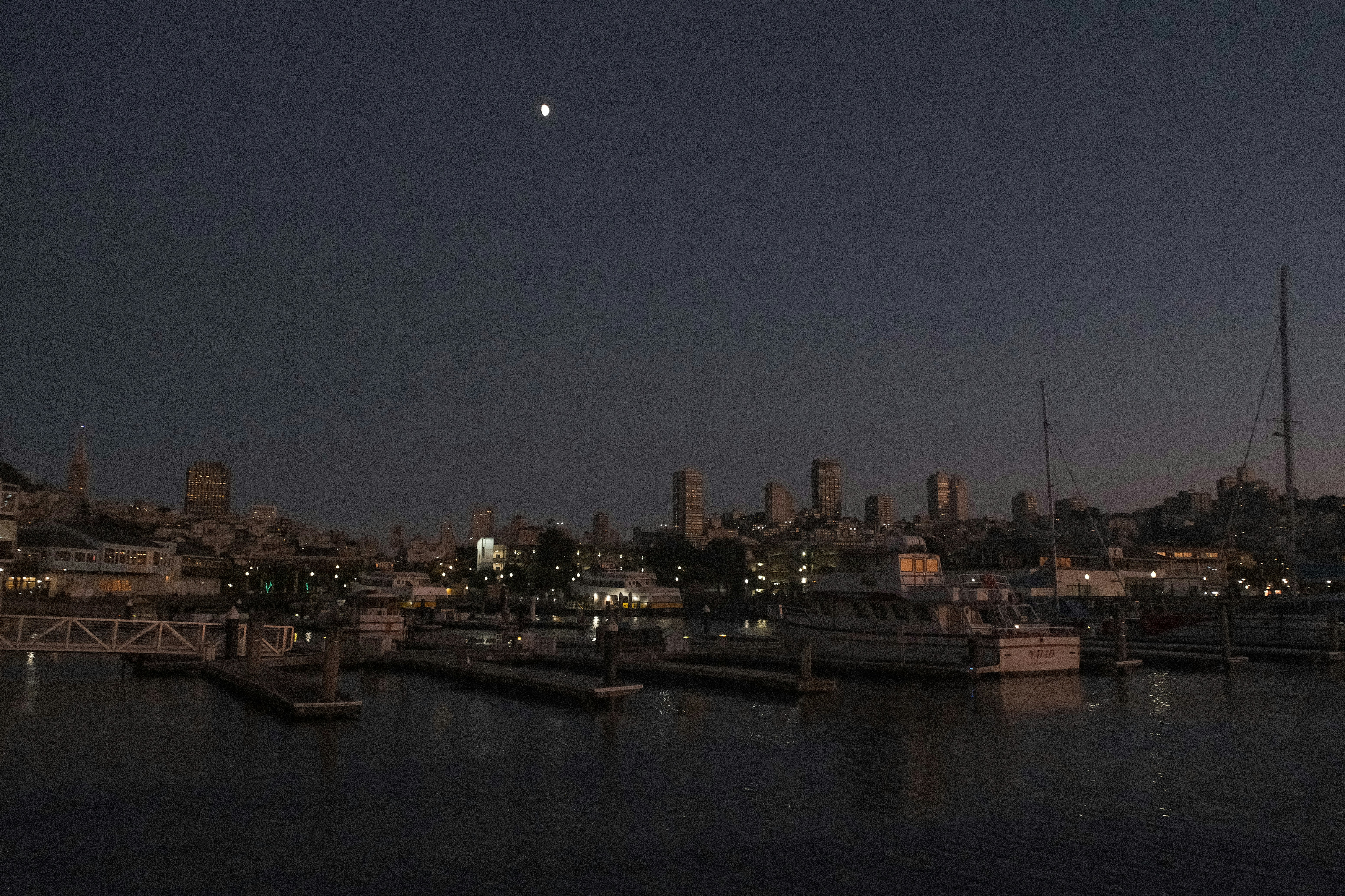 Moonlit Marina: Quiet Docks Under Urban Night Lights