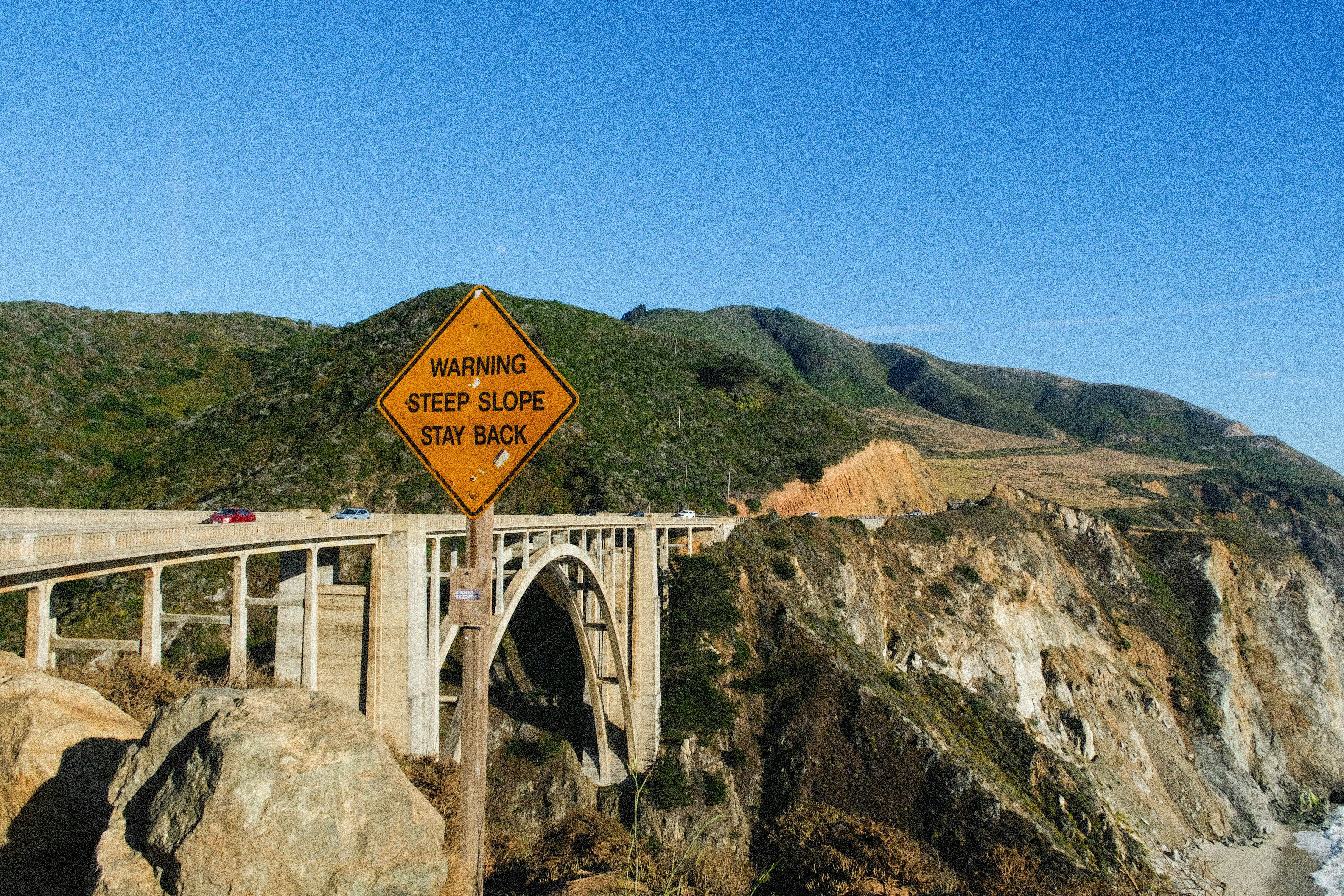 Warning Sign Overlook: Canyon Bridge and Coastal Cliffs