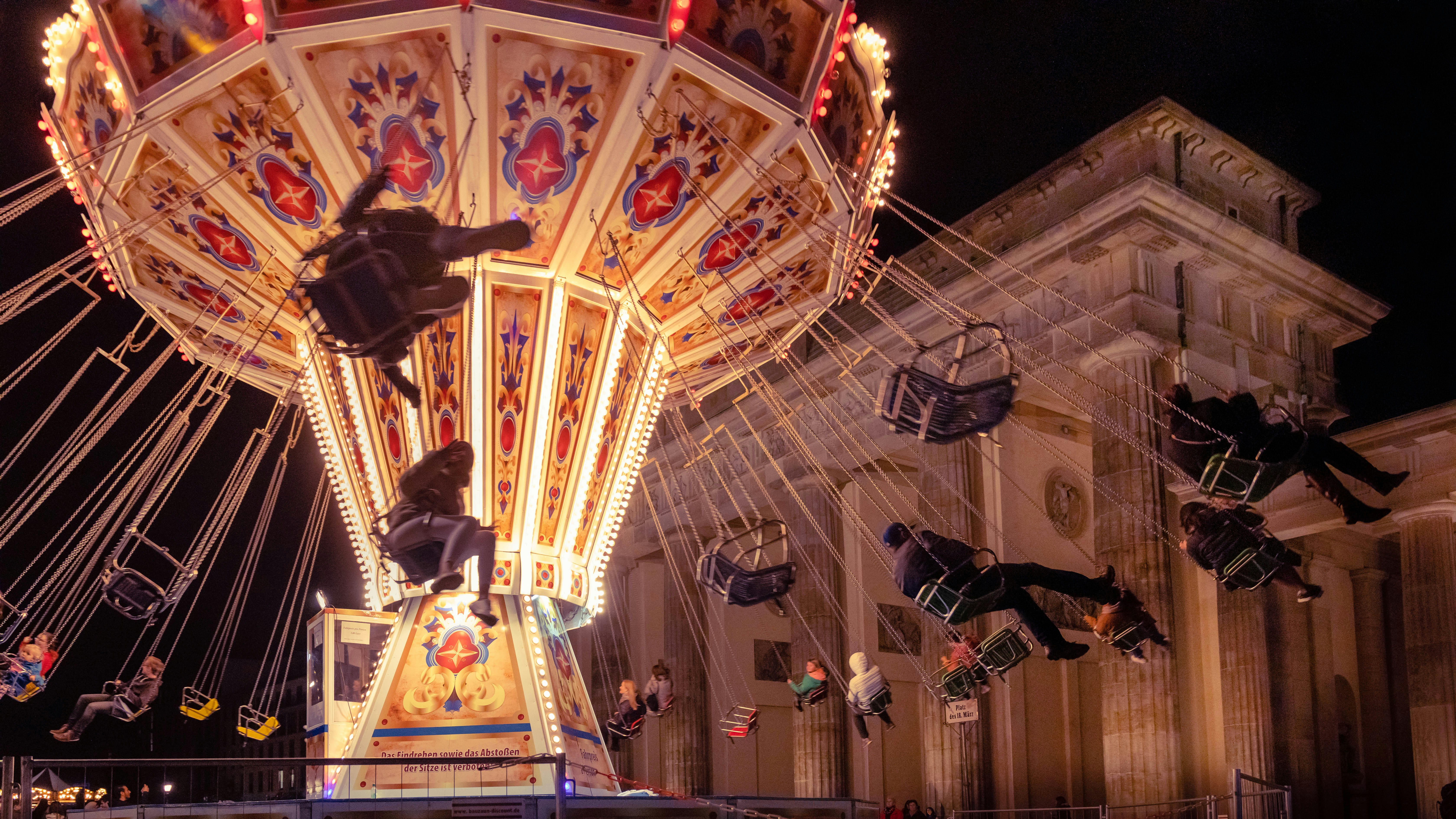 Wheel of Color: Night Carousel Carriages in Flight