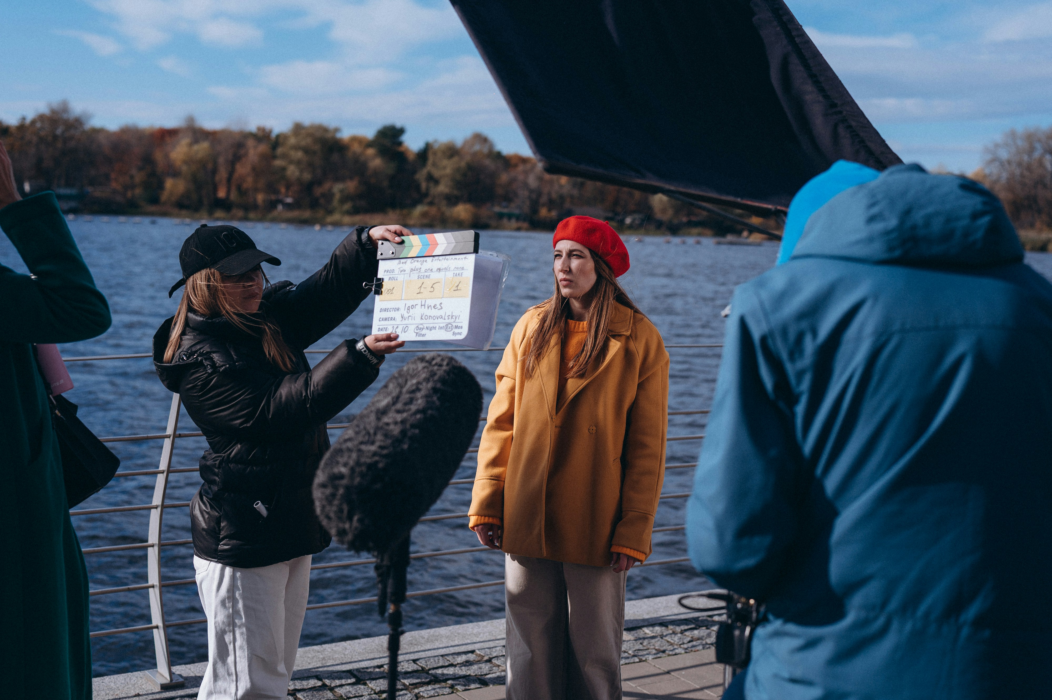 On Deck: A Crew Practices with a Centered Clapper on a Wind-Swept Waterfront