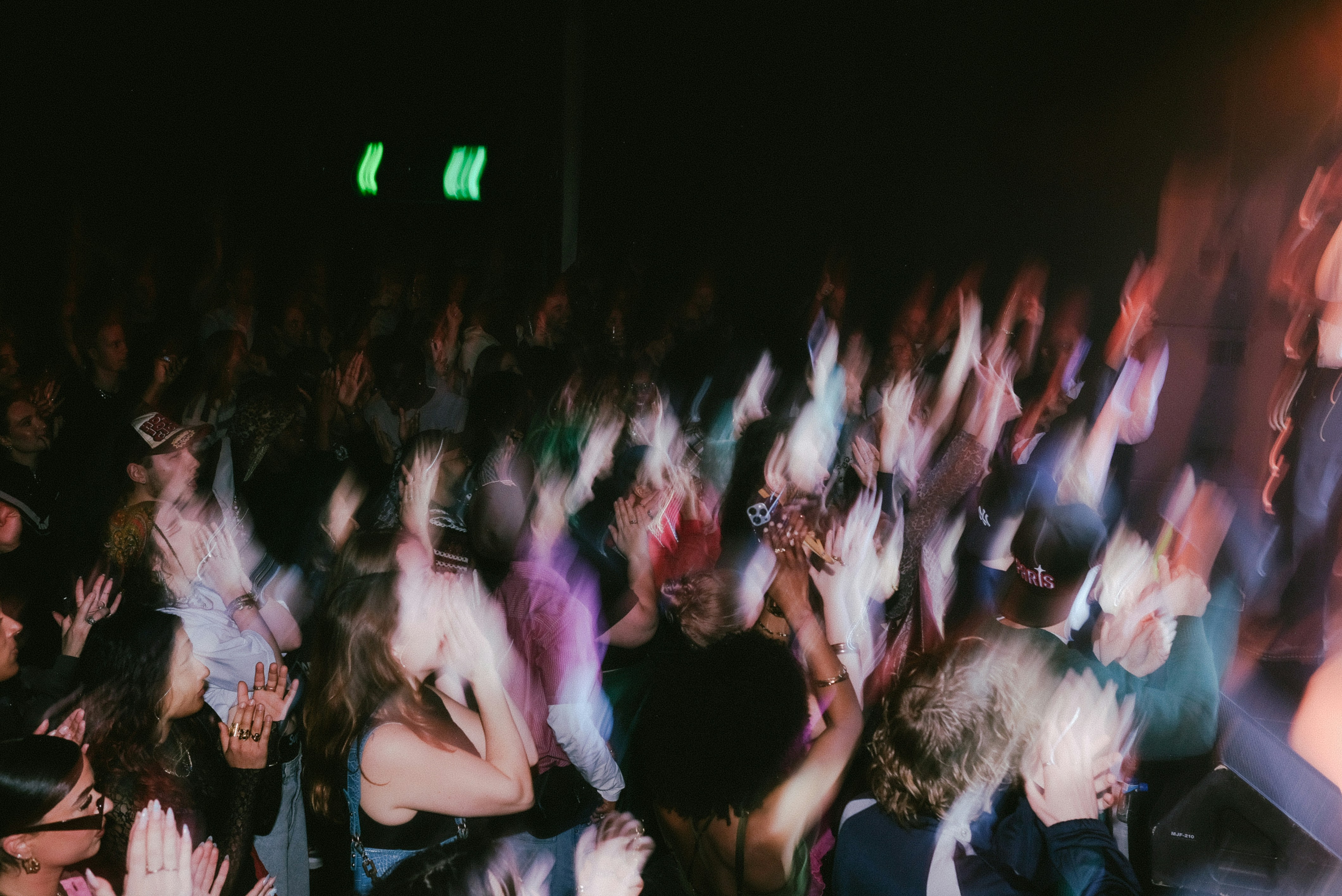 Midnight Echoes: Blurred Crowd in a Dimming Club