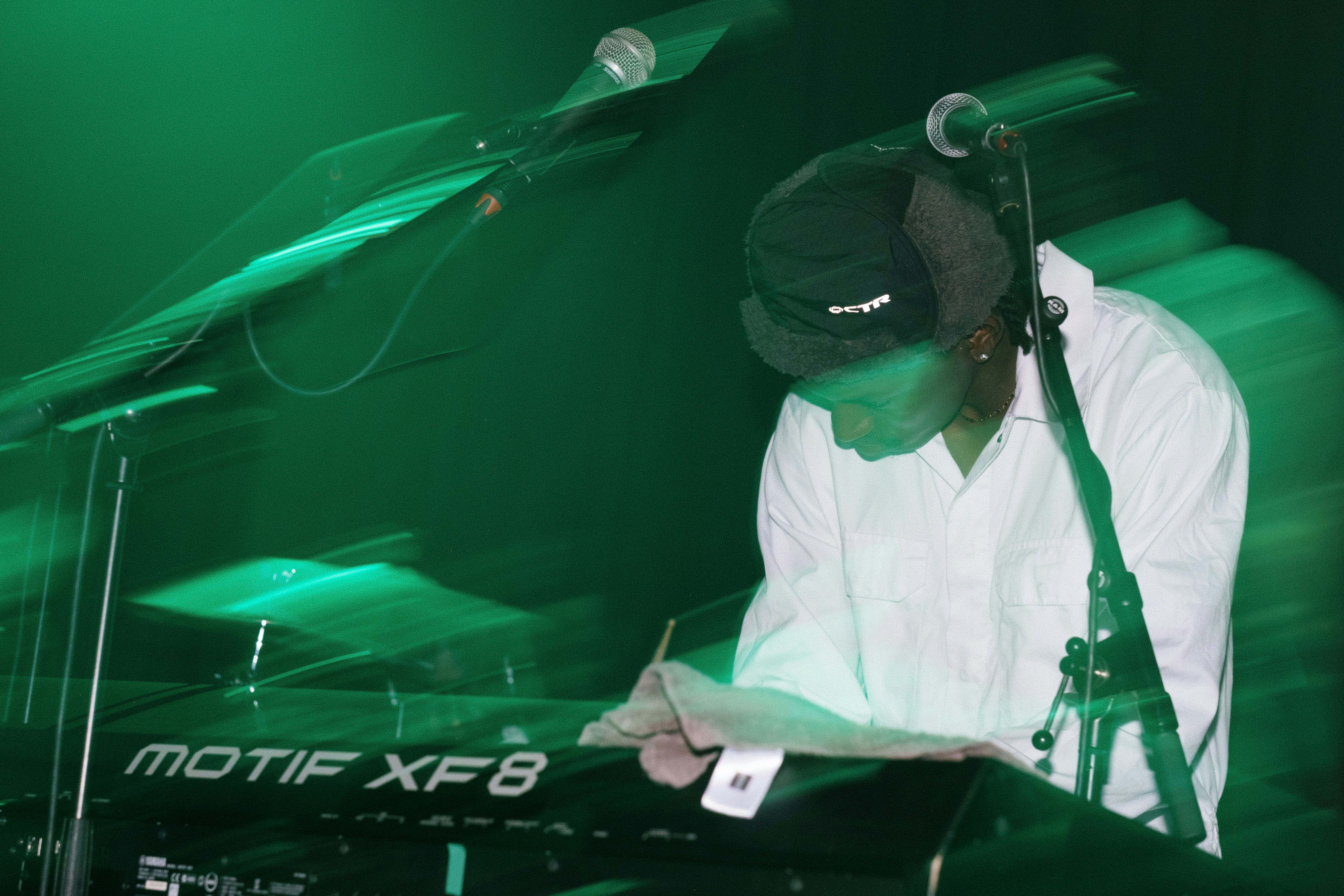 Green Neon Keys: A Live Moment with a Solo Keyboardist