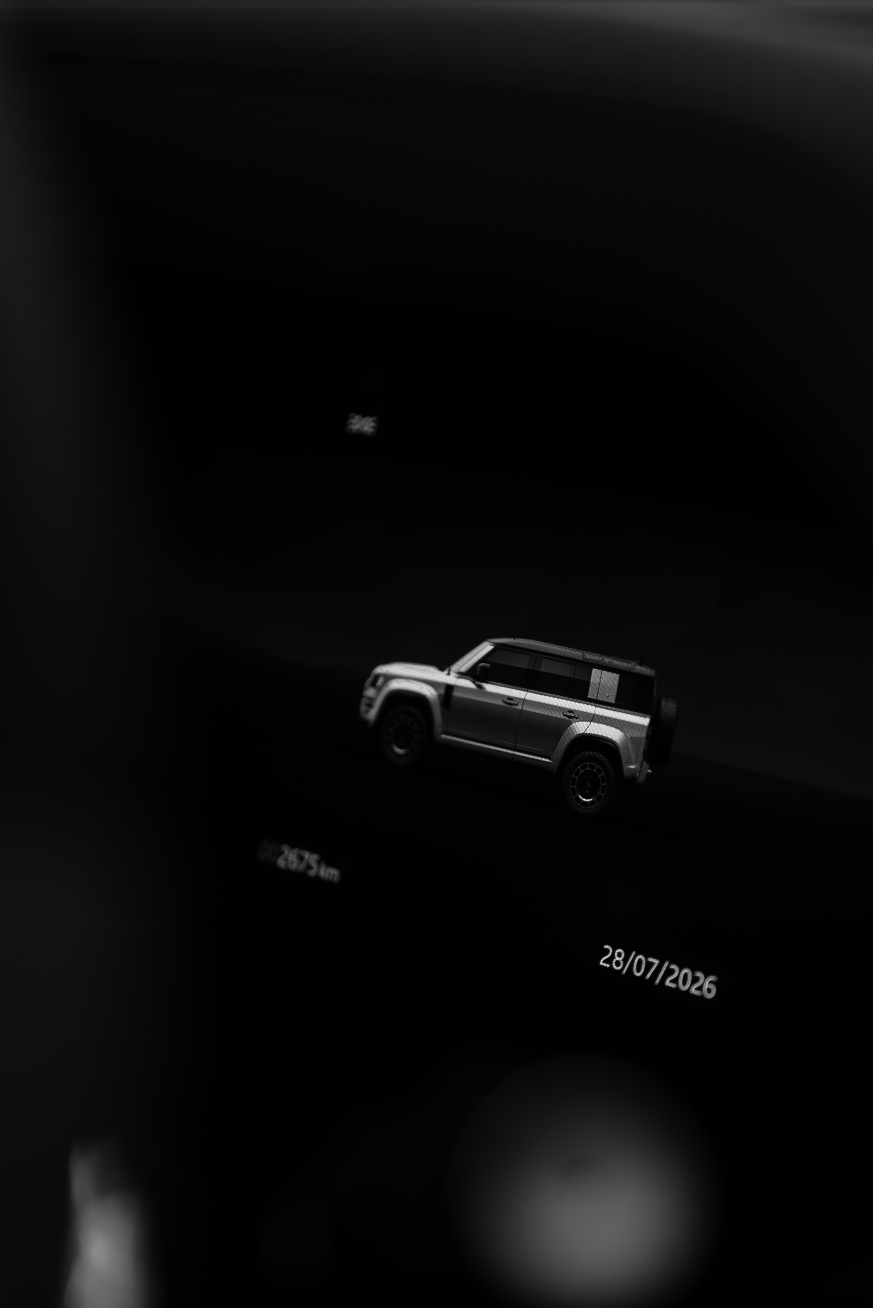 Miniature SUV on a Dark Digital Dash: A Subtle Night Drive
