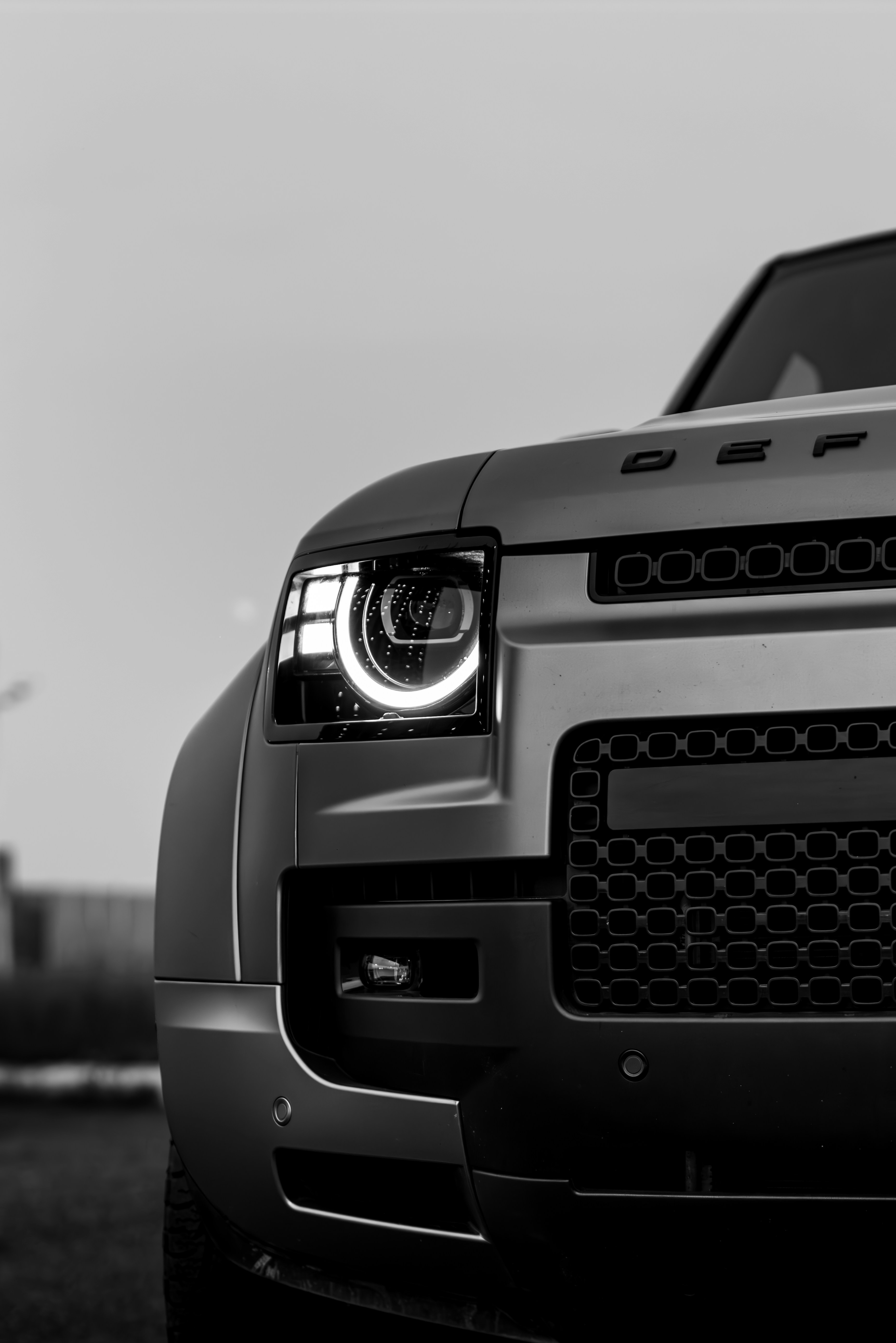 Front-Quarter Power: A Bold Close-Up of the Front Grille and Headlight