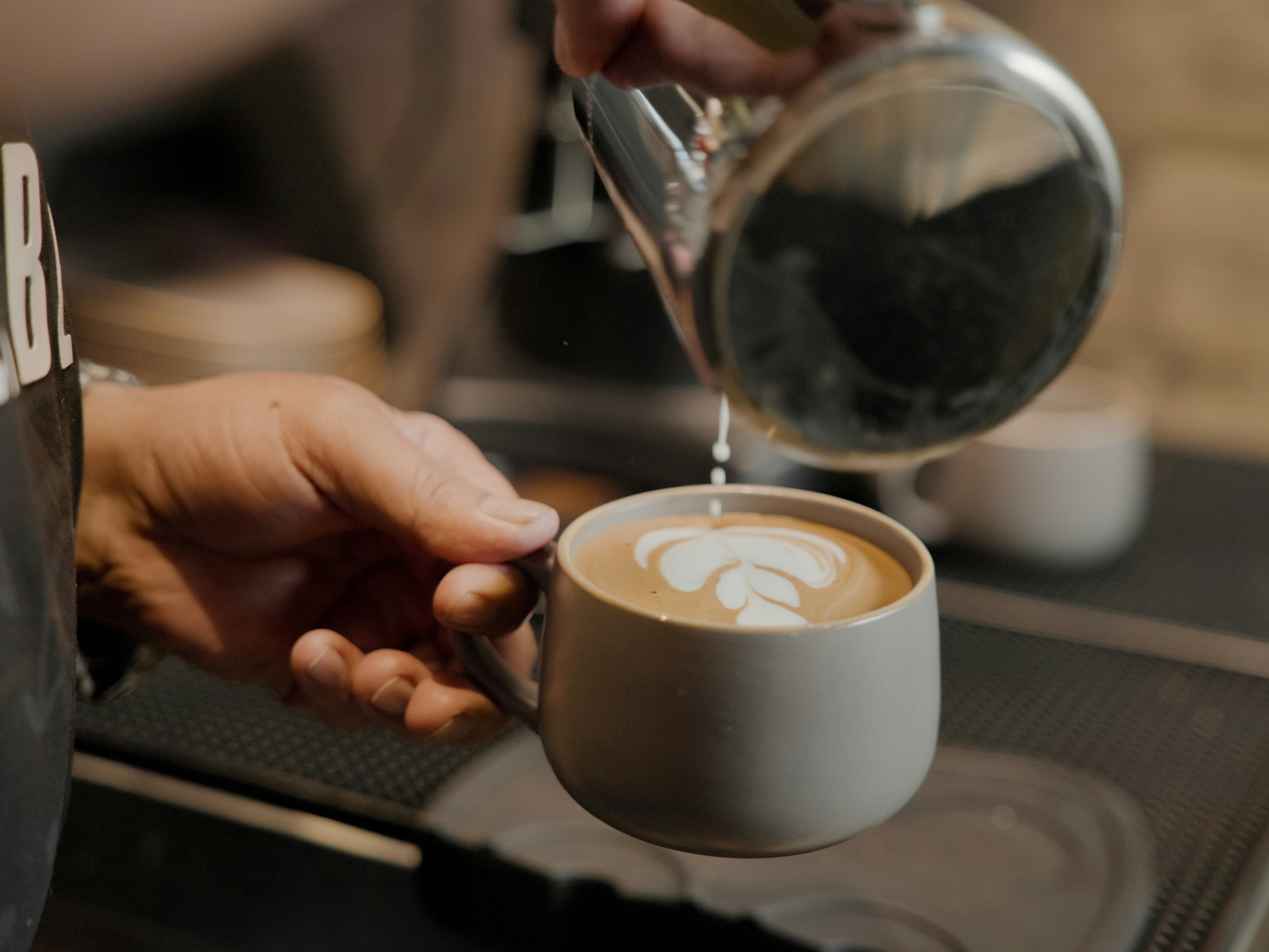 Pouring Art: Barista Craft in a Ceramic Cup