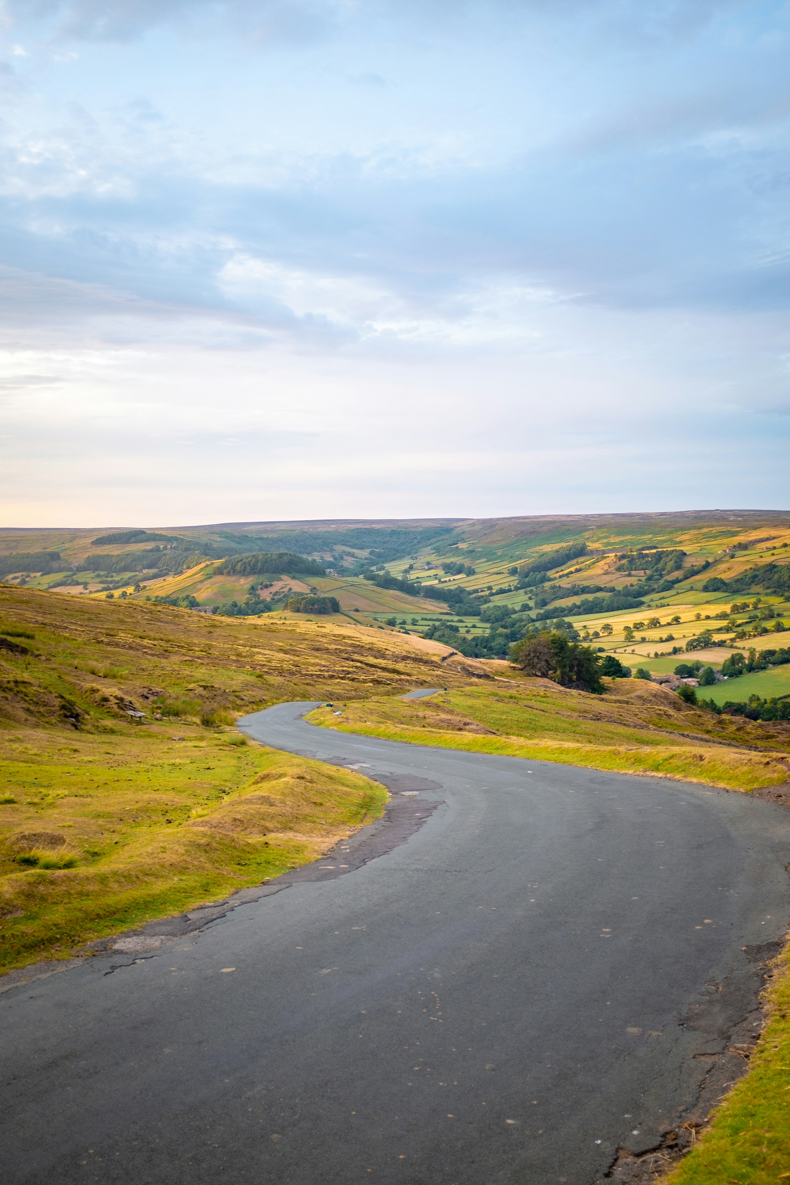 Meandering Lane Through Rolling Moorland at Dusk