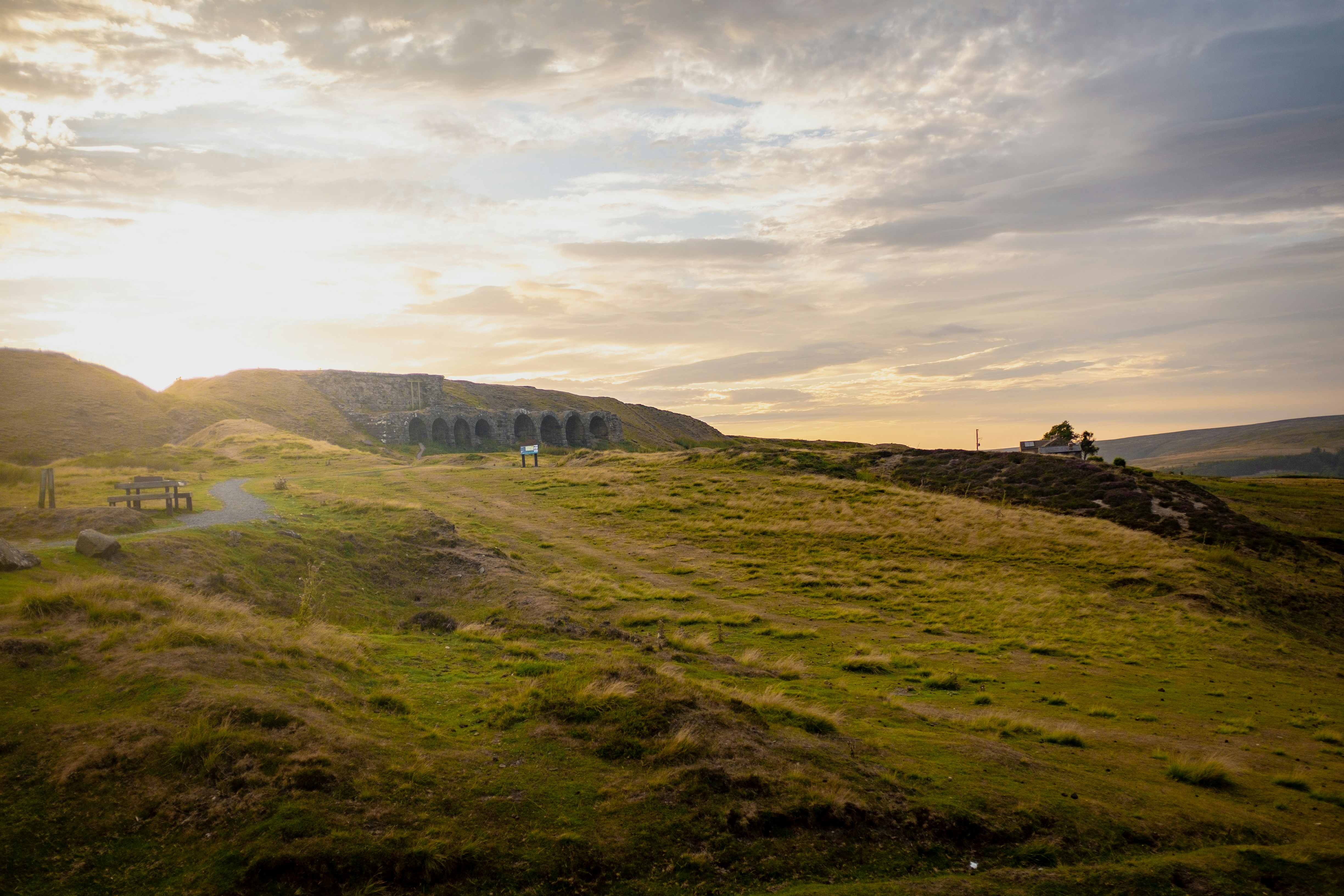 Golden Horizon Over Rolling Moor: Sunset on a Quiet Plateau