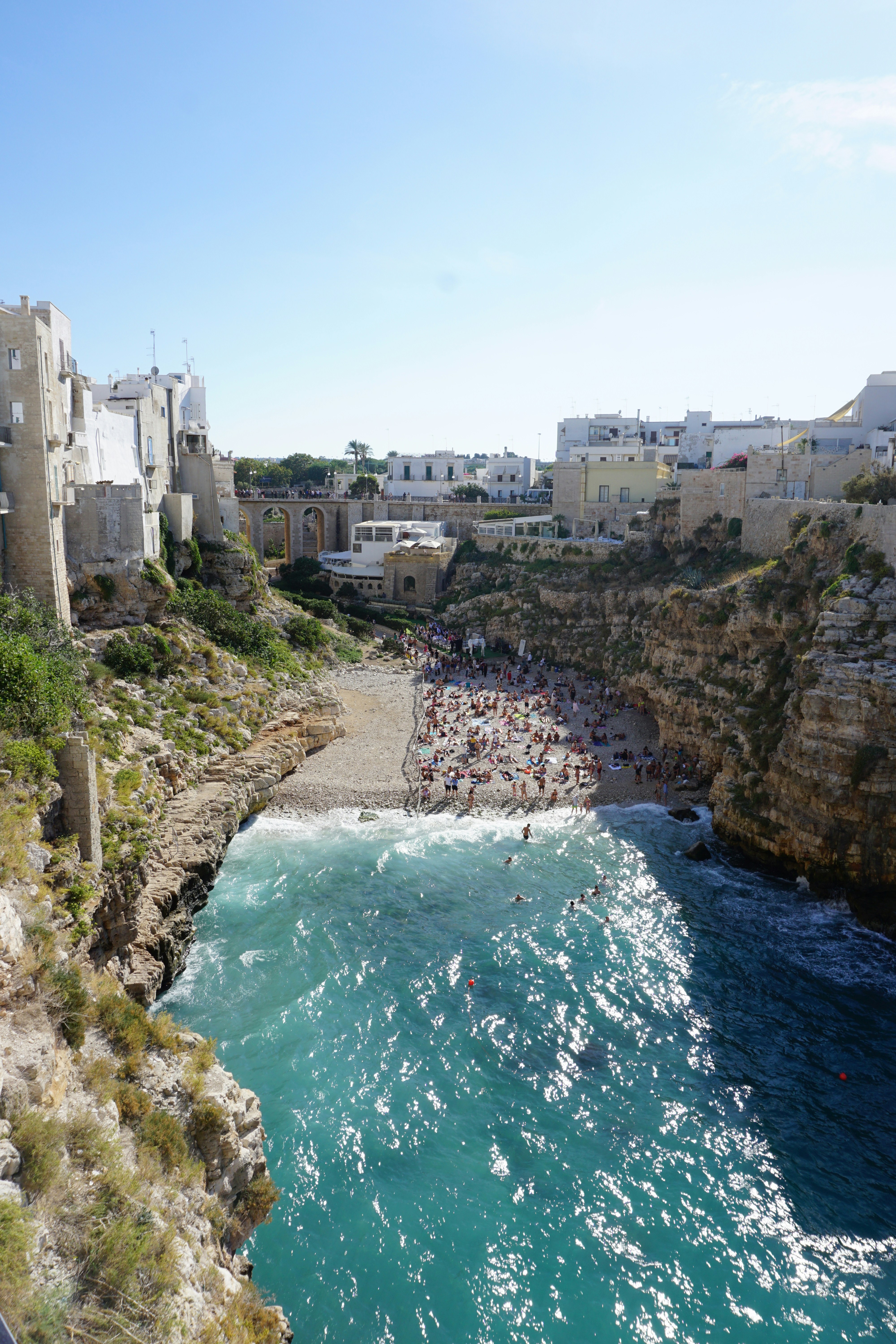 Cliffside Cove: A Sunlit Beach Town Framed by Turquoise Waters