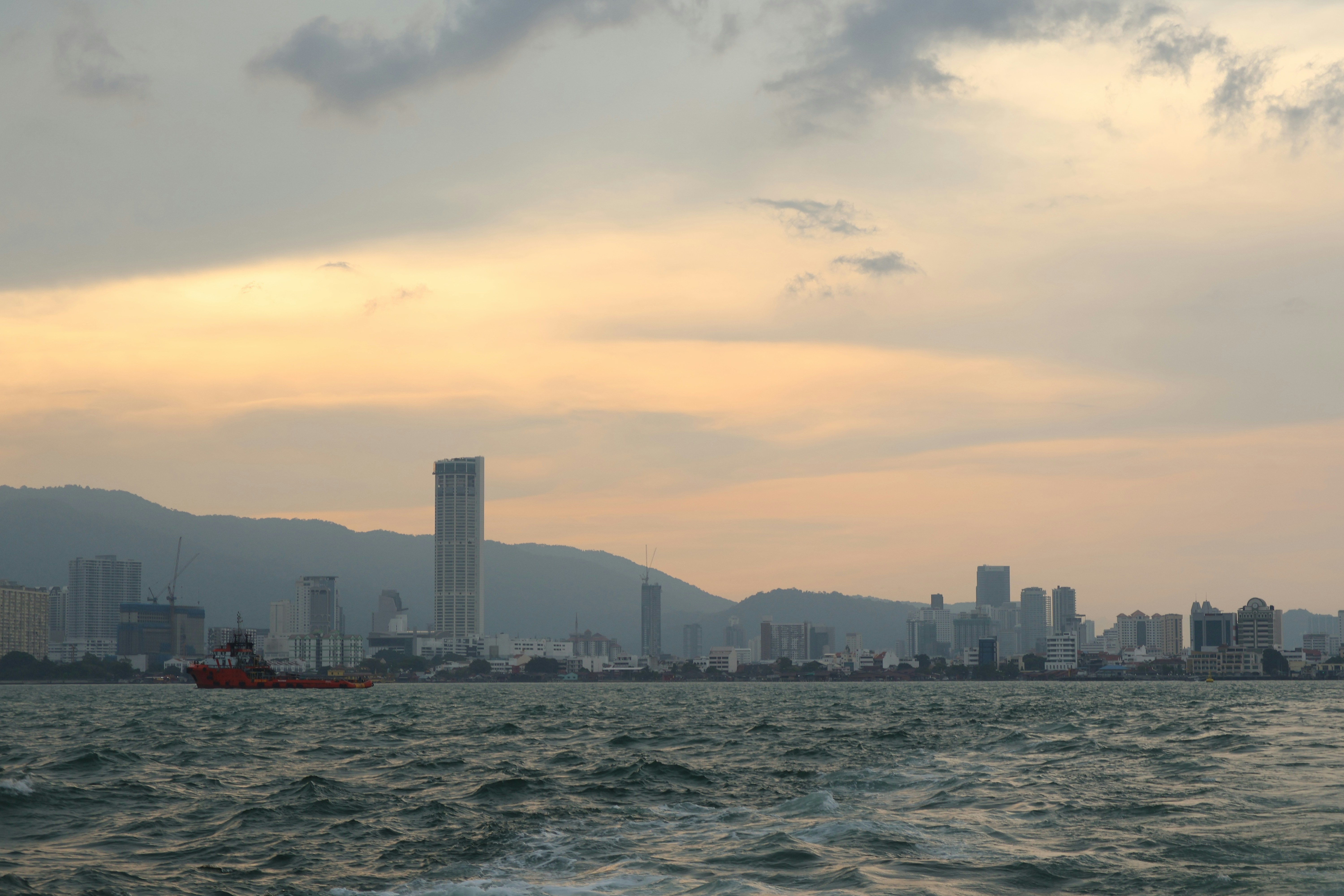 Harbor Skyline at Dusk: A Quiet Sea Against a Distant City