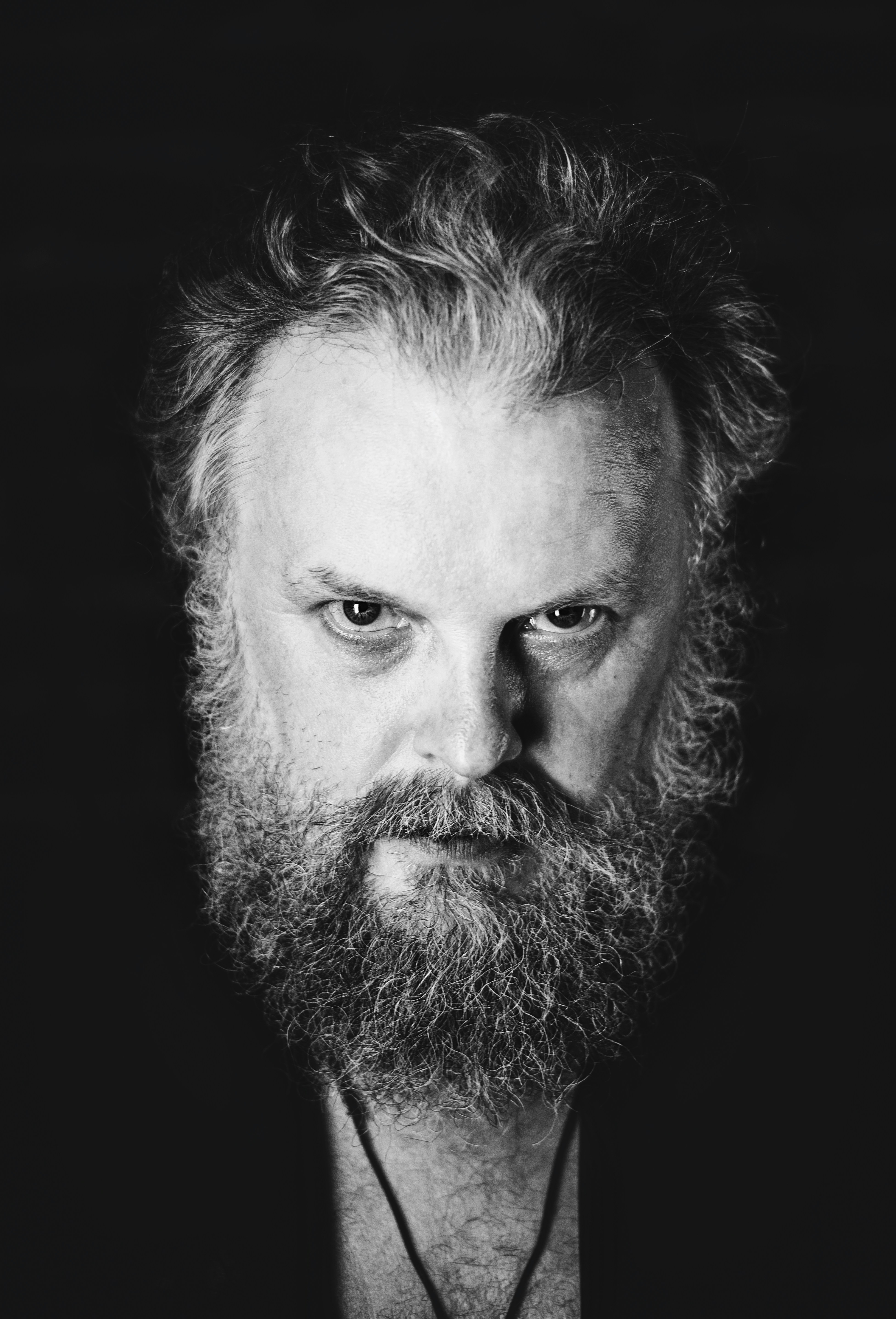 Midnight Gaze: A Rugged Portrait in Mono