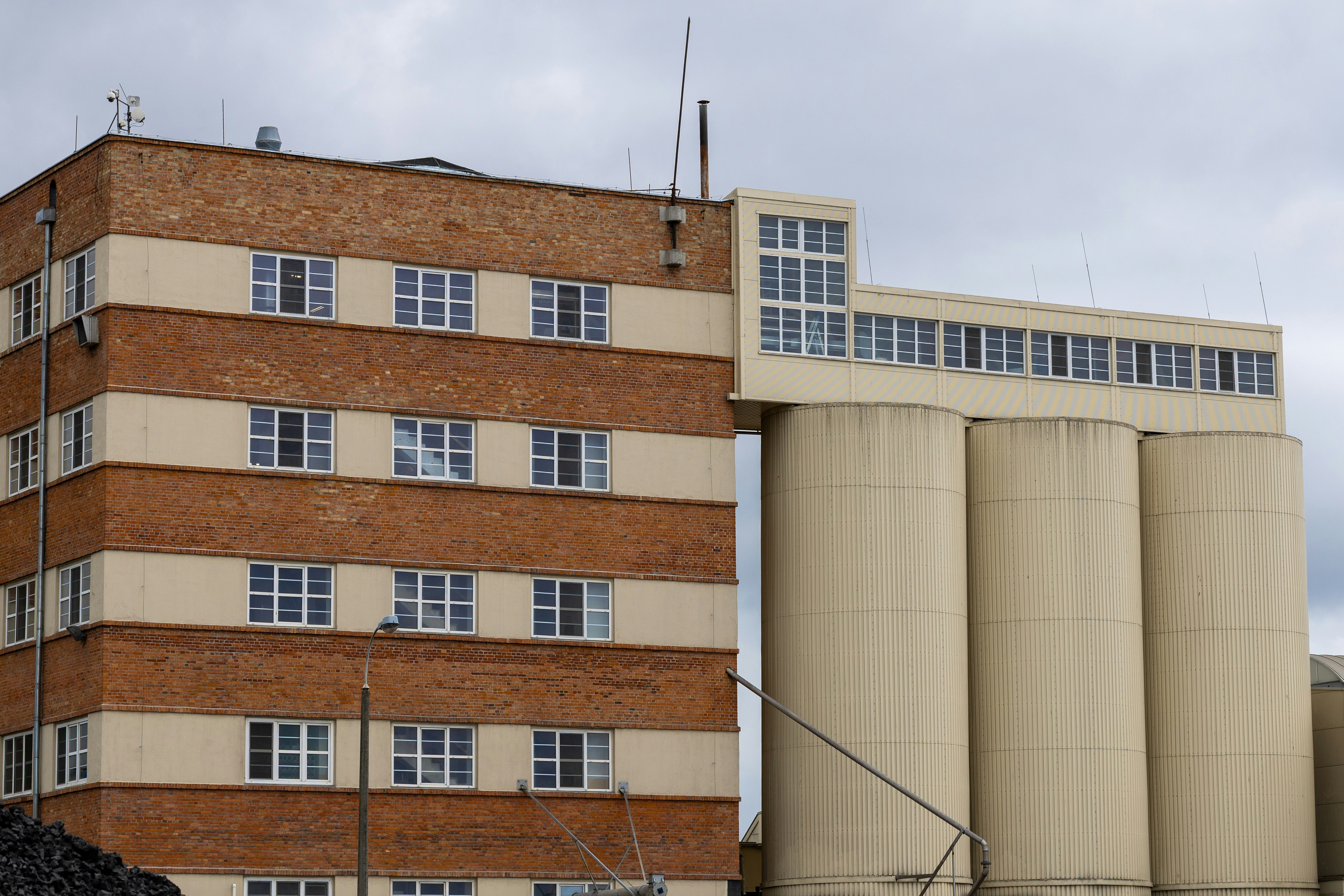 Brick-and-concrete Industrial Facade Under a Quiet Sky