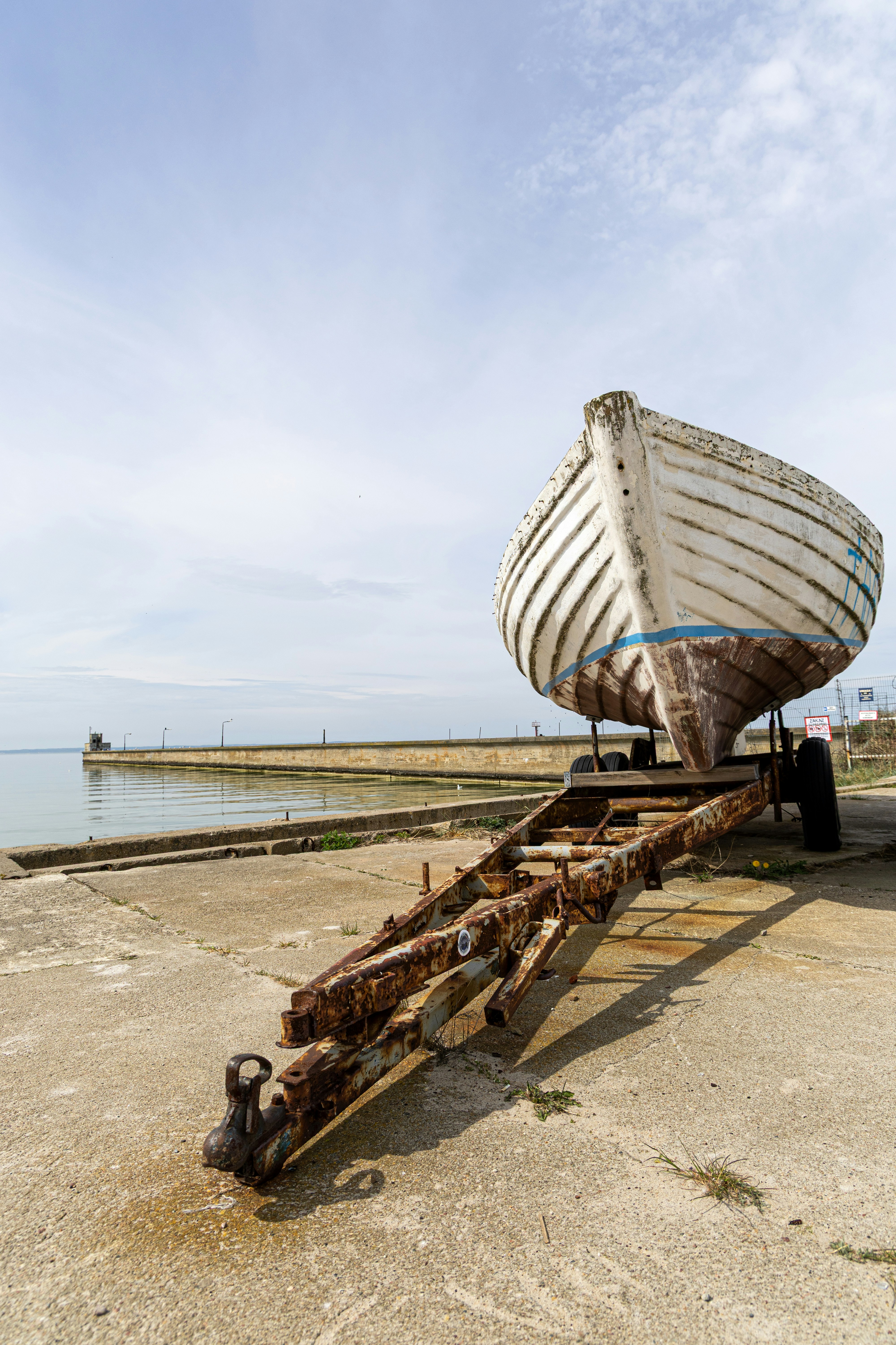 Weathered Boat on a Quiet Shore: Rust, Wood, and Wake of Time