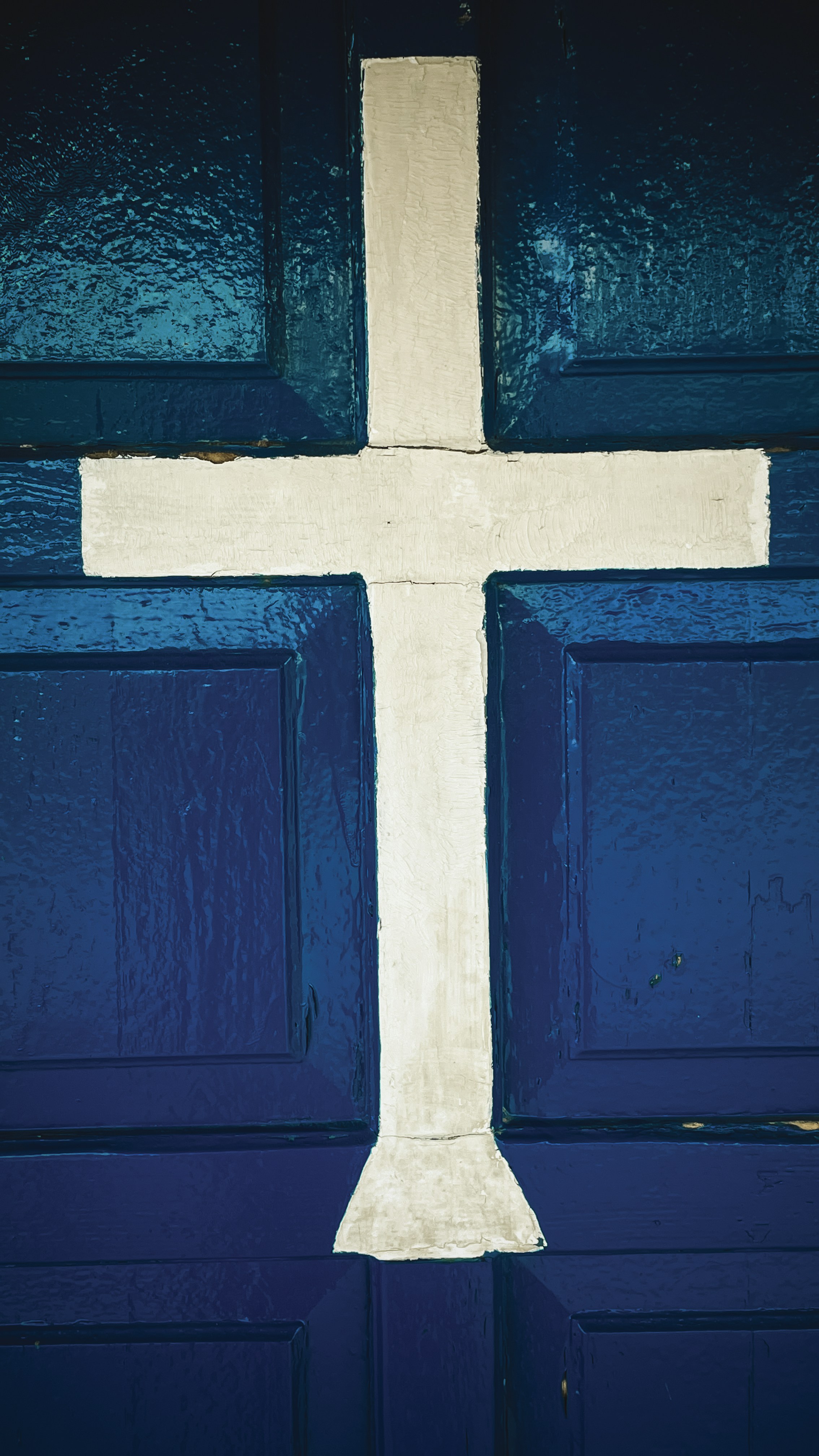 Crossing Doorway: A White Keystone on Deep Blue Panels