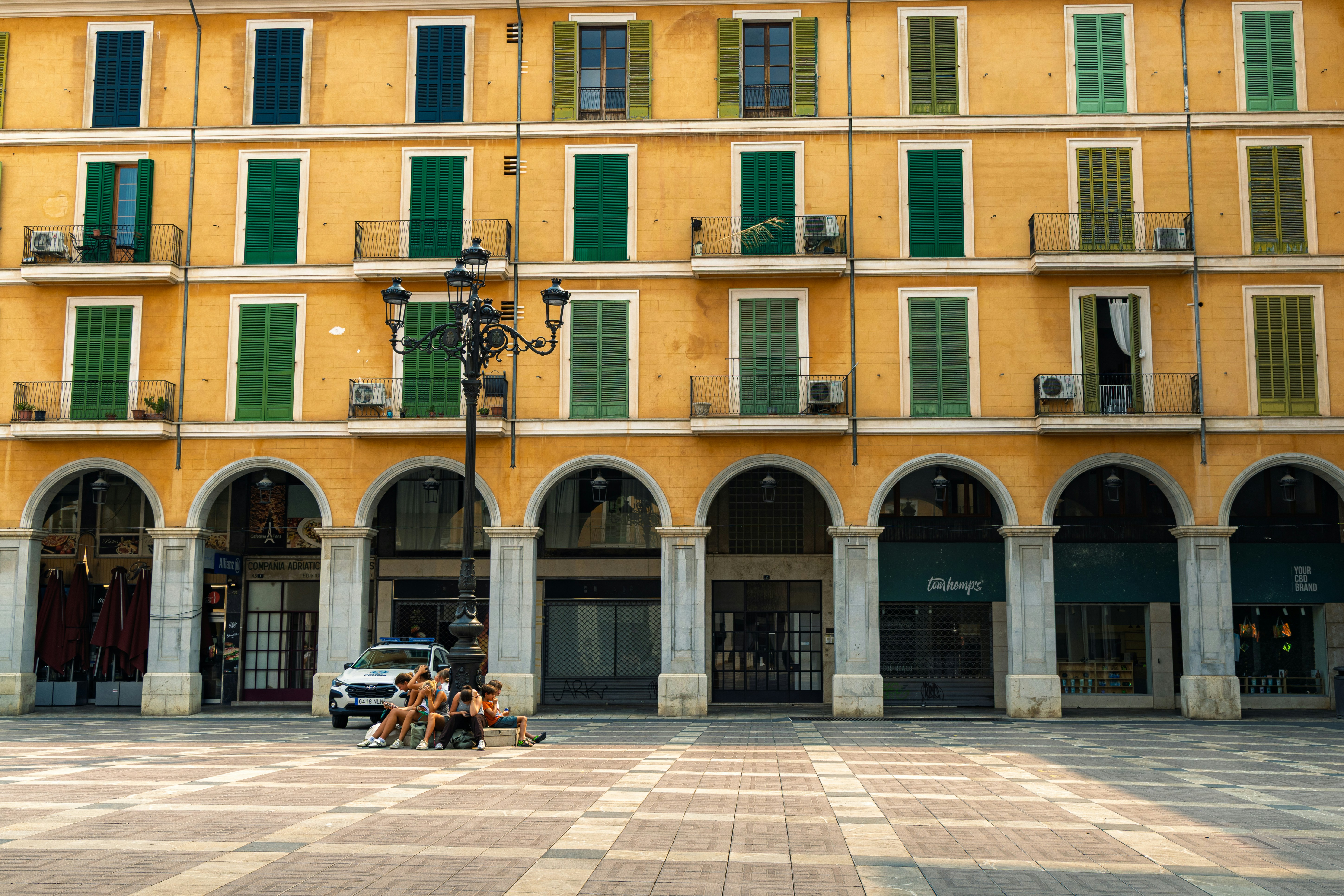 Glowing Arcades and A Sunlit Square